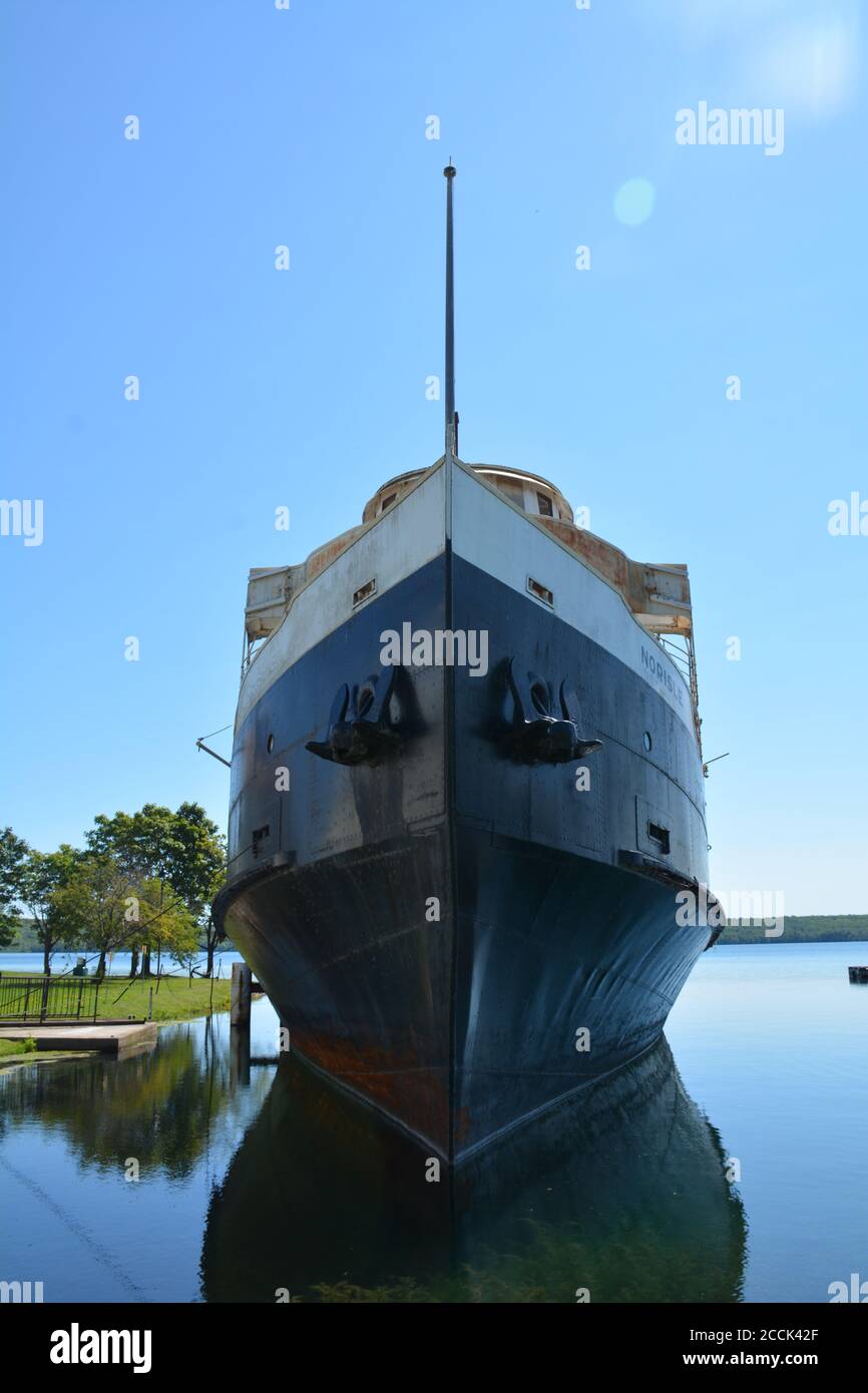 Old Great Lakes freighter at rest in small pier on Manitoulin Island ...