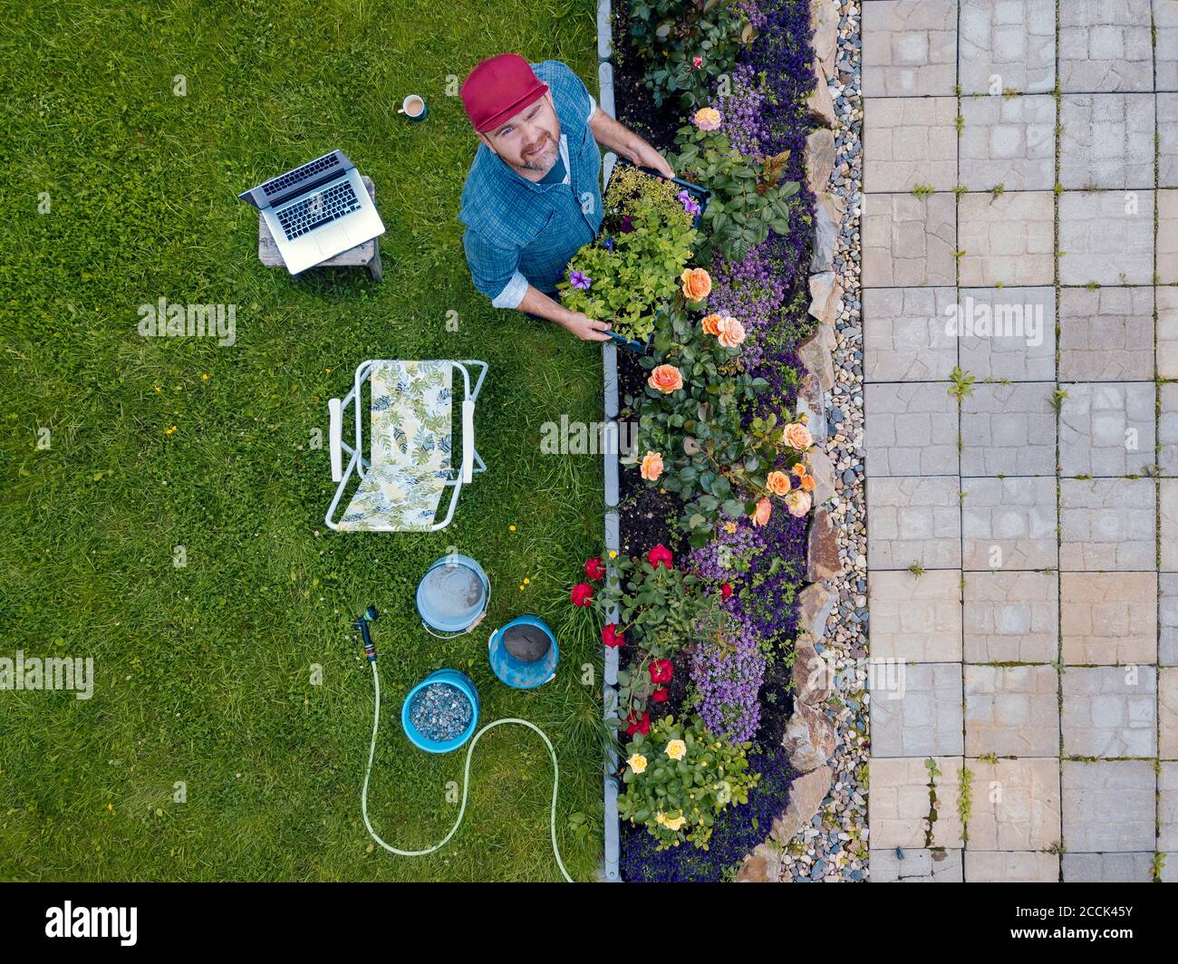 Aerial view of man in garden Stock Photo - Alamy
