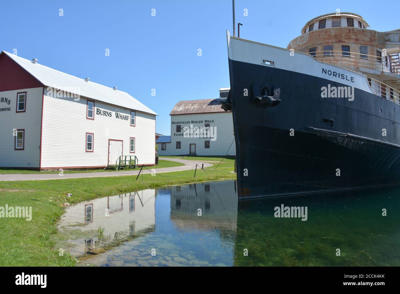 Old Great Lakes freighter at rest in small pier on Manitoulin Island ...
