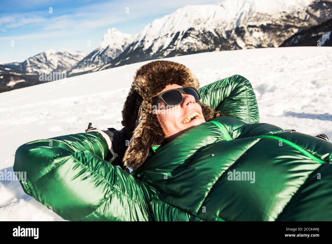 Person lying in snow hi-res stock photography and images - Alamy