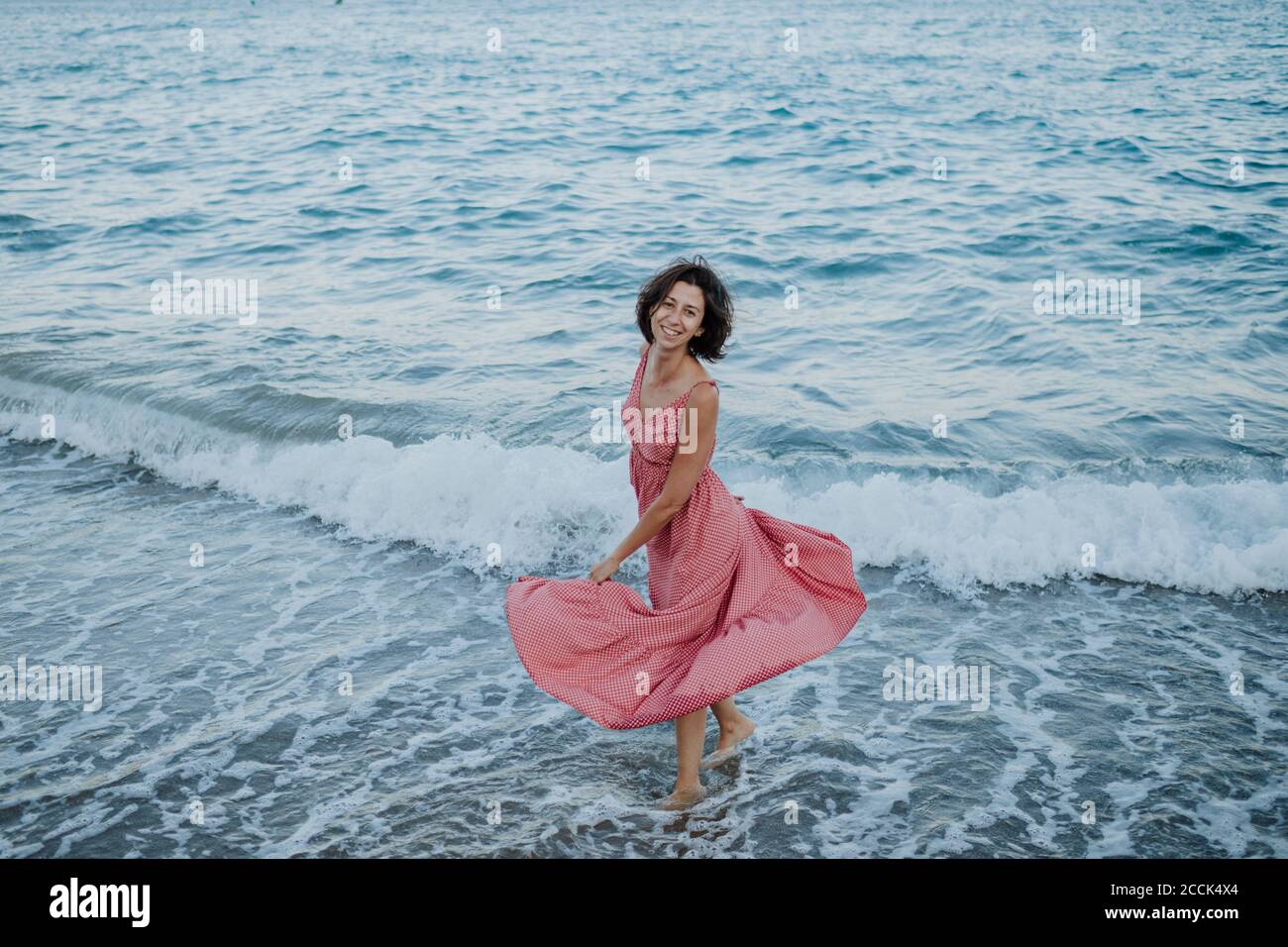 Woman wearing dress in water hi-res stock photography and images - Alamy