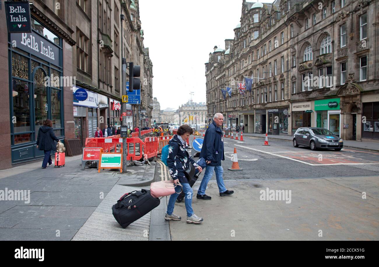 North Bridge, roadworks, tourists crossing road, Edinburgh, Scotland ...