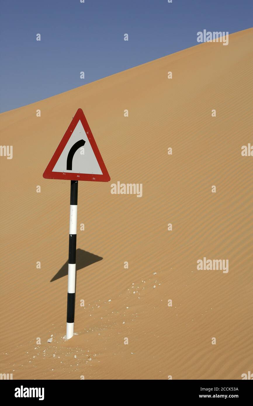United Arab Emirates, Emirate of Abu Dhabi, Road sign on dune at ...
