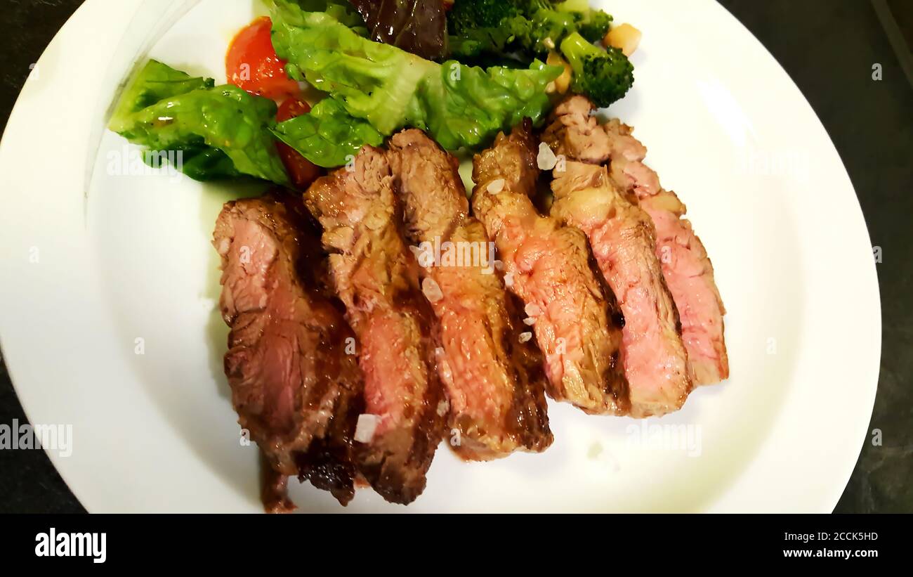 good Tasty grilled meat on a grill plate Stock Photo - Alamy