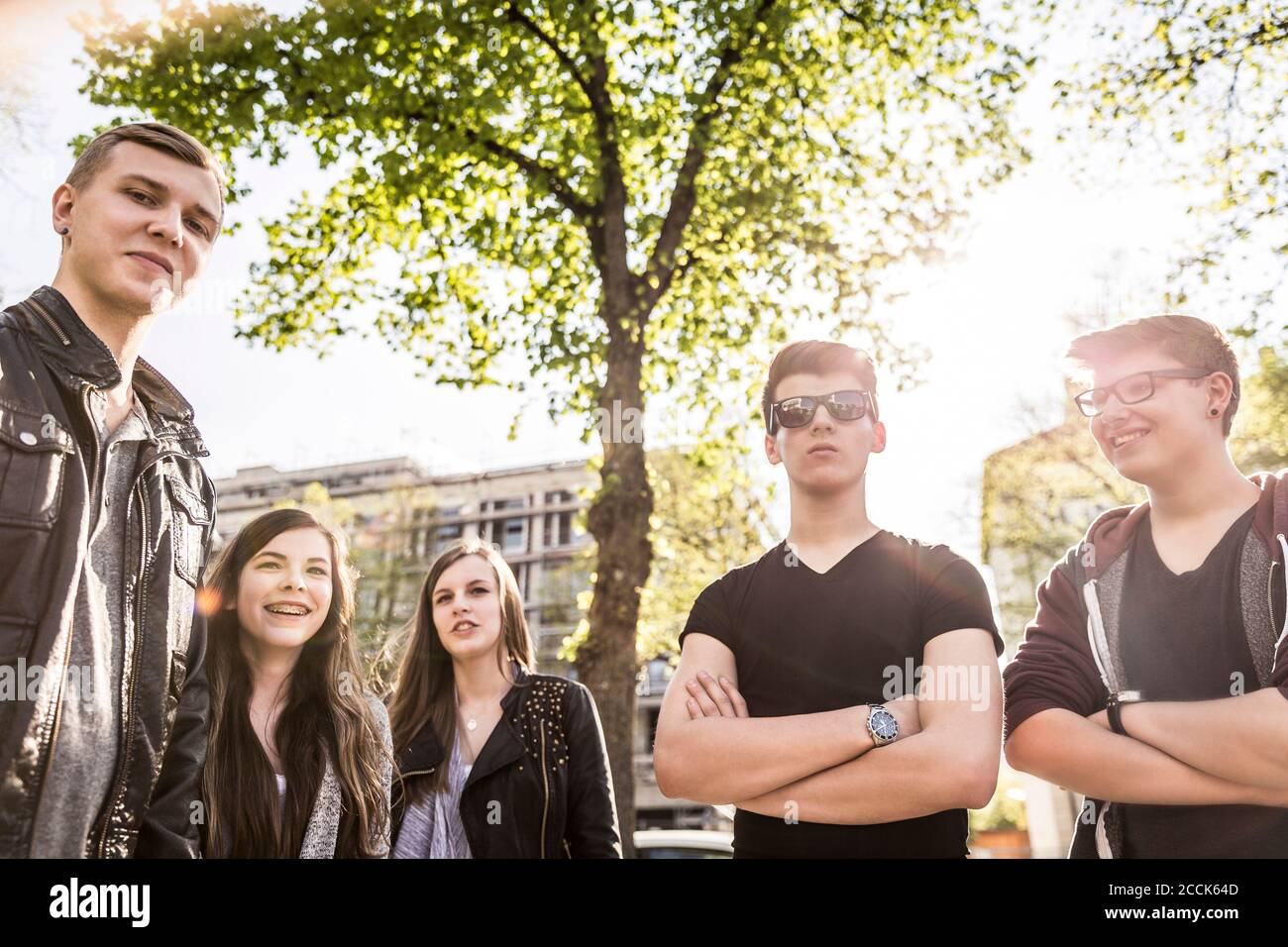 Portrait of group of friends hanging out in an urban setting Stock ...