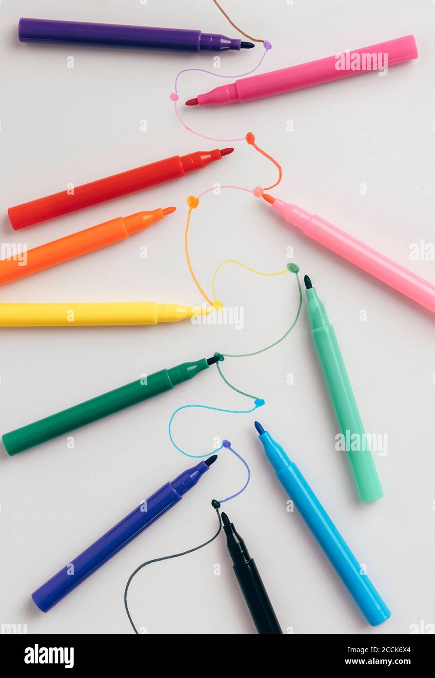 Colorful felt tip pens connected with curved lines Stock Photo - Alamy