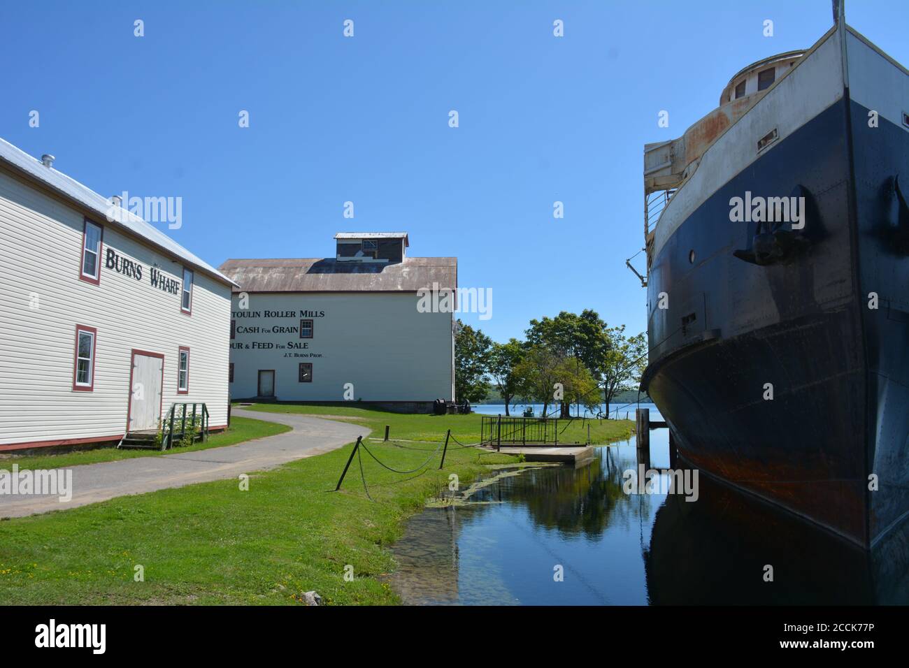 Old Great Lakes freighter at rest in small pier on Manitoulin Island ...