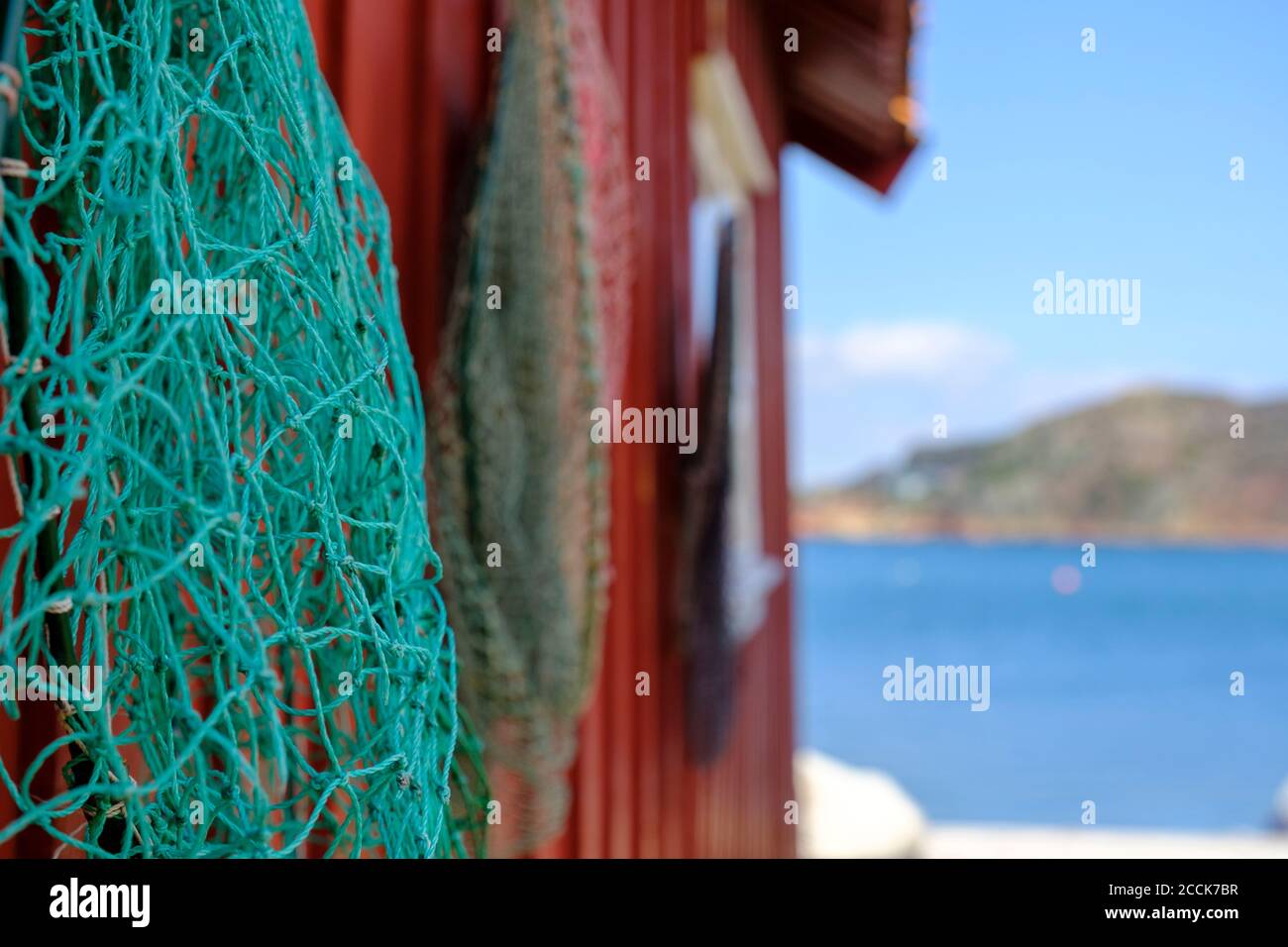 Fishing net hanging outdoors Stock Photo - Alamy