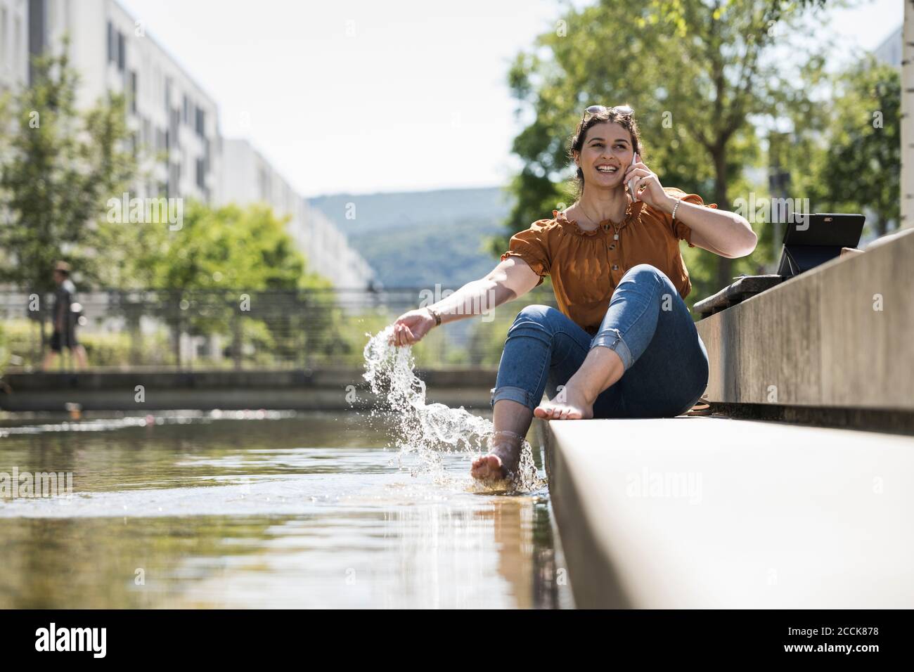 Woman playing on smart phone hi-res stock photography and images - Alamy
