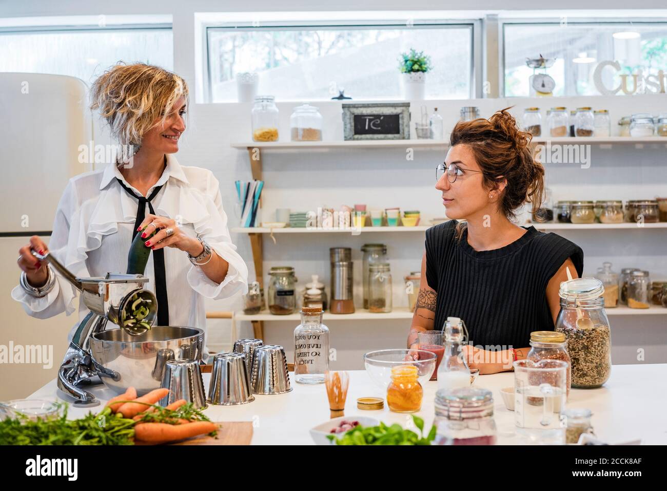 Female chef using food processor while teaching at cooking class Stock ...