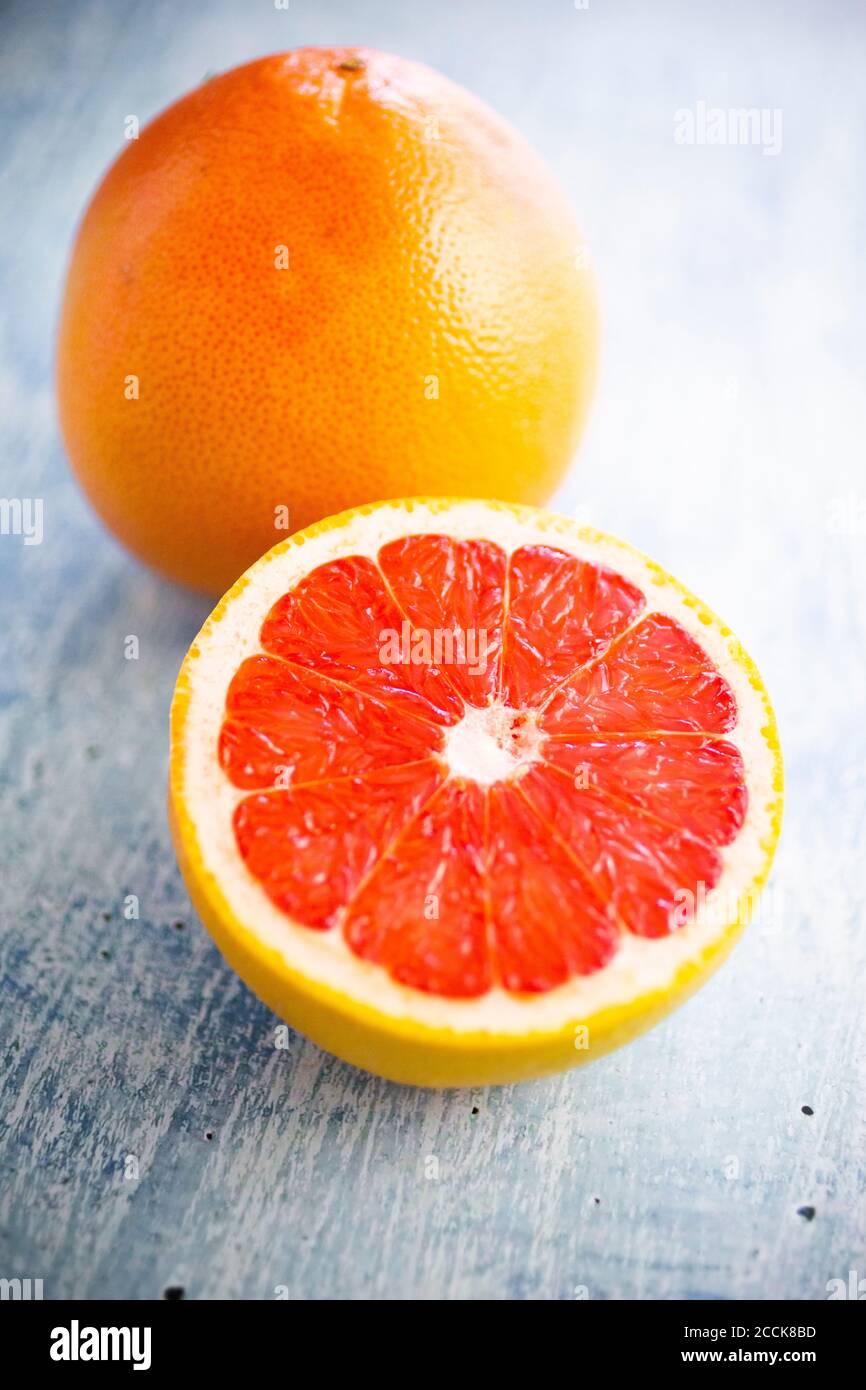 Fresh chopped grapefruit on wood Stock Photo - Alamy