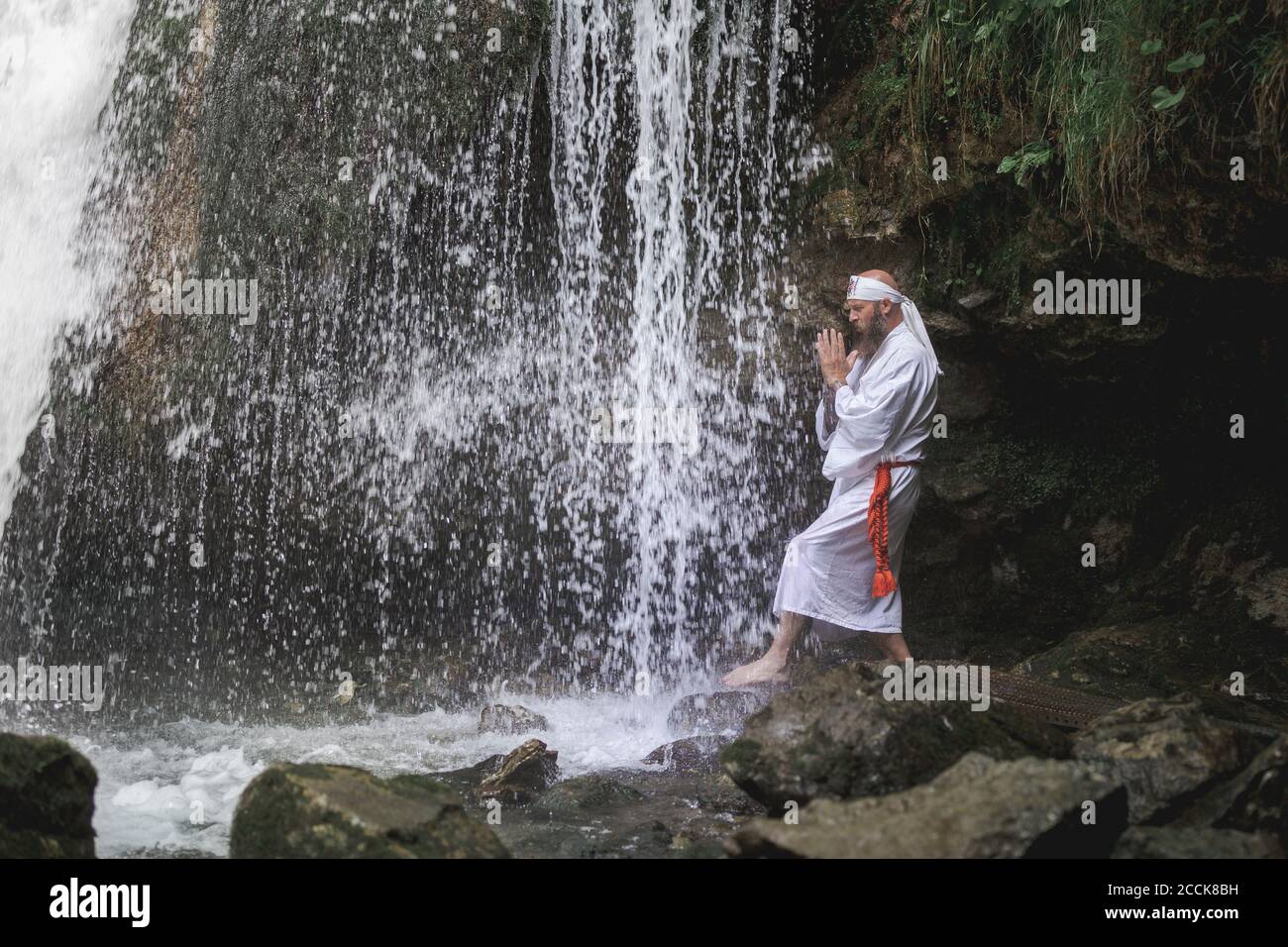 European yamabushi monk doing takigyo waterfall meditation Stock Photo ...