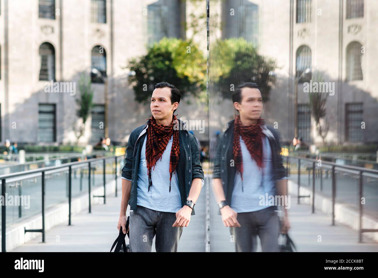 Reflection man walking glass hi-res stock photography and images - Alamy