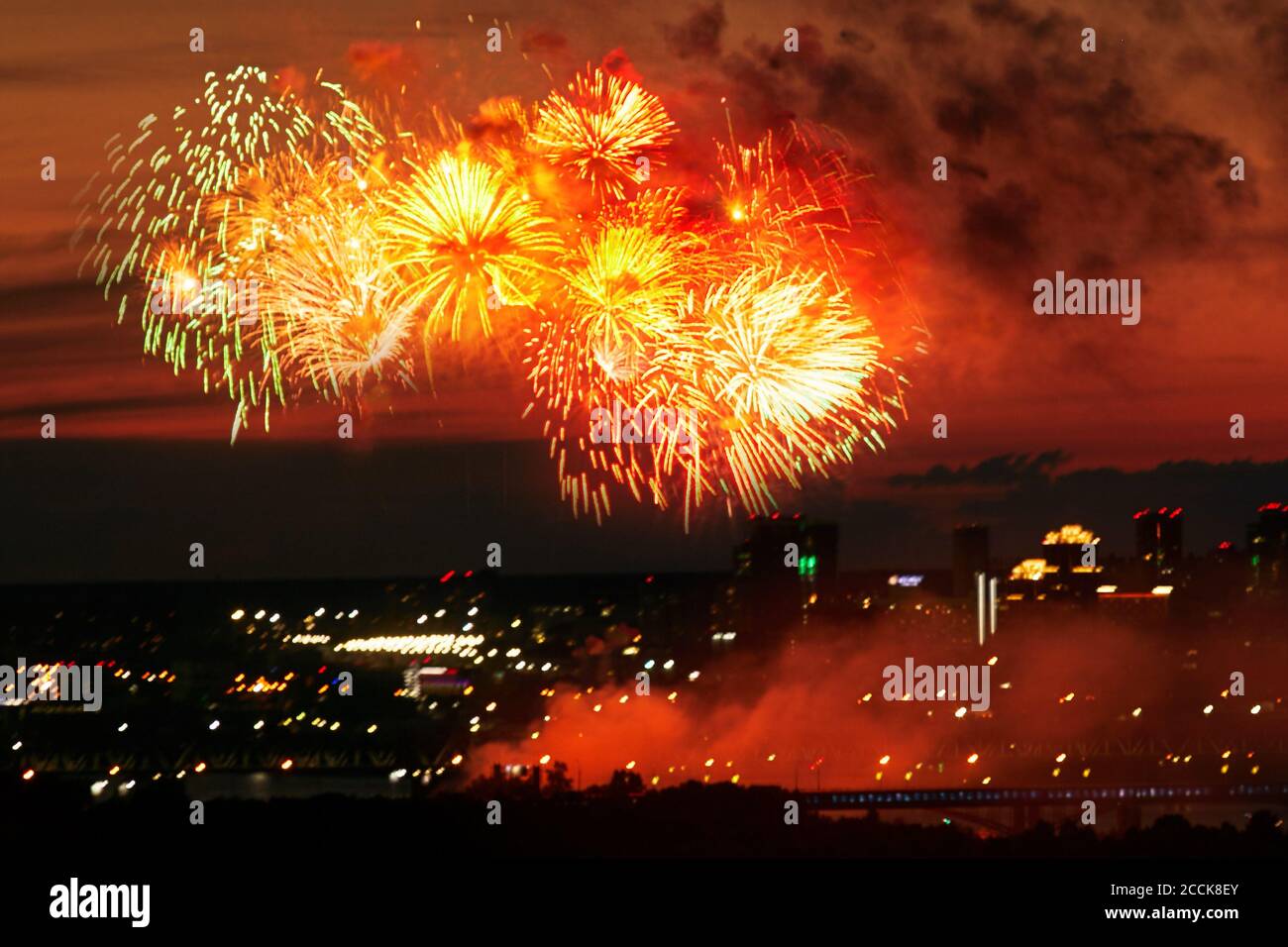 Fantastic fireworks over night city Stock Photo - Alamy