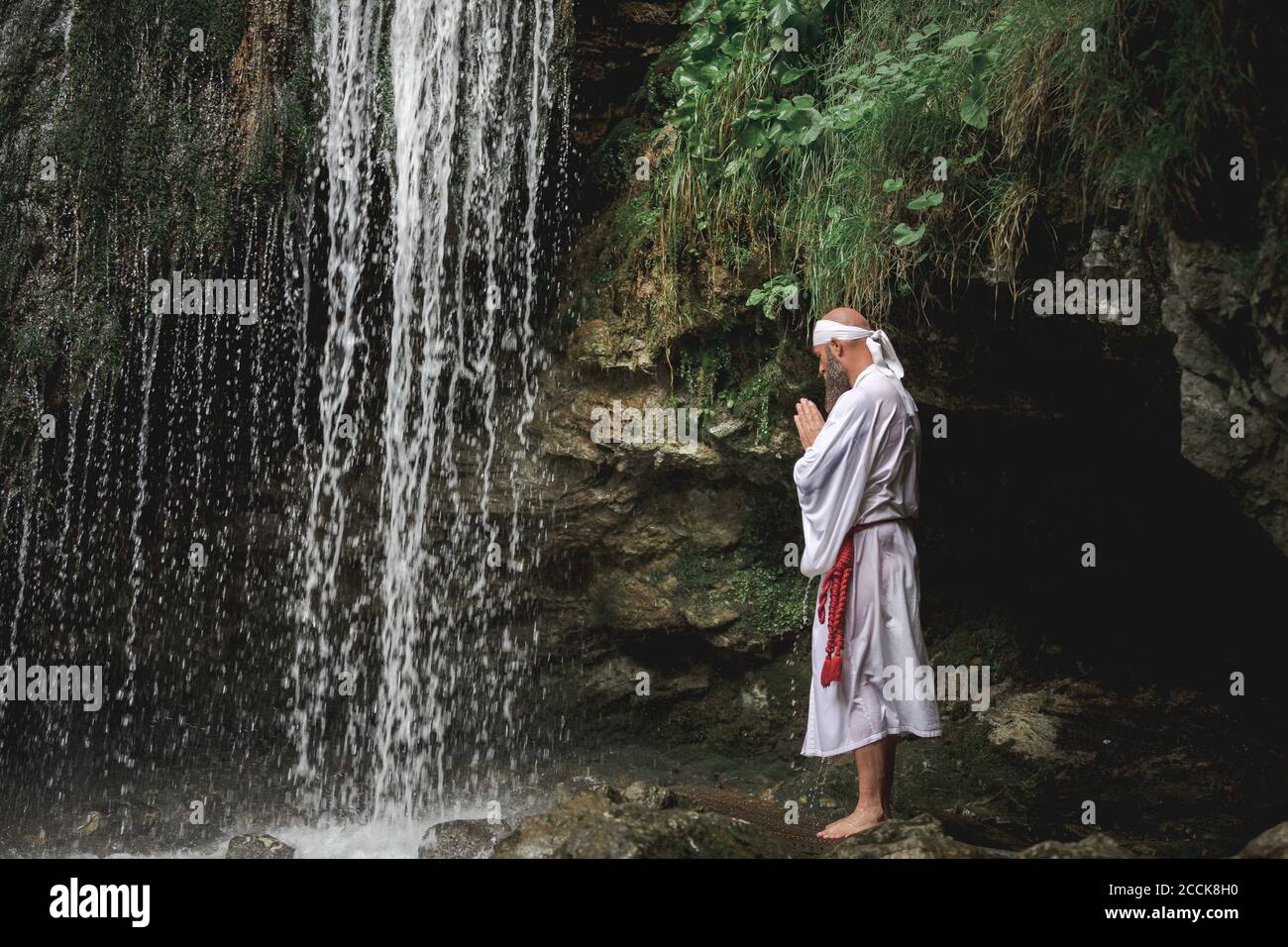 European yamabushi monk doing takigyo waterfall meditation Stock Photo ...
