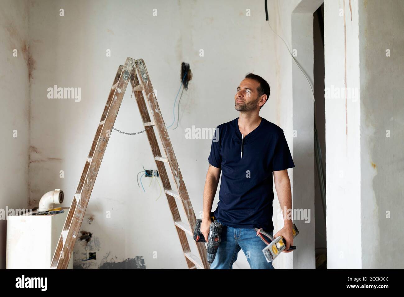 Man worker under new construction site hi-res stock photography and ...