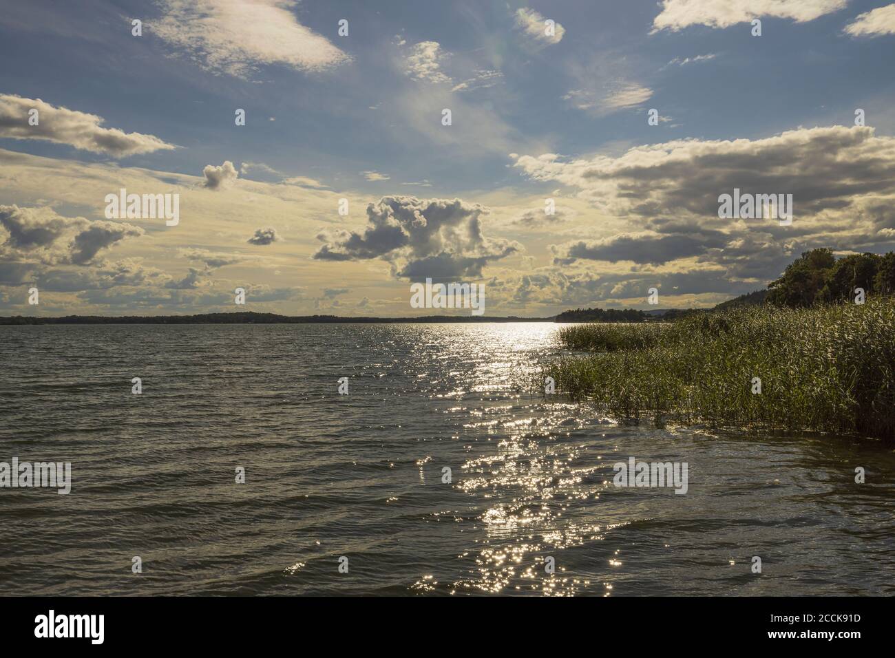Amazing beauty sunset on Baltic sea on blue sky with white clouds ...