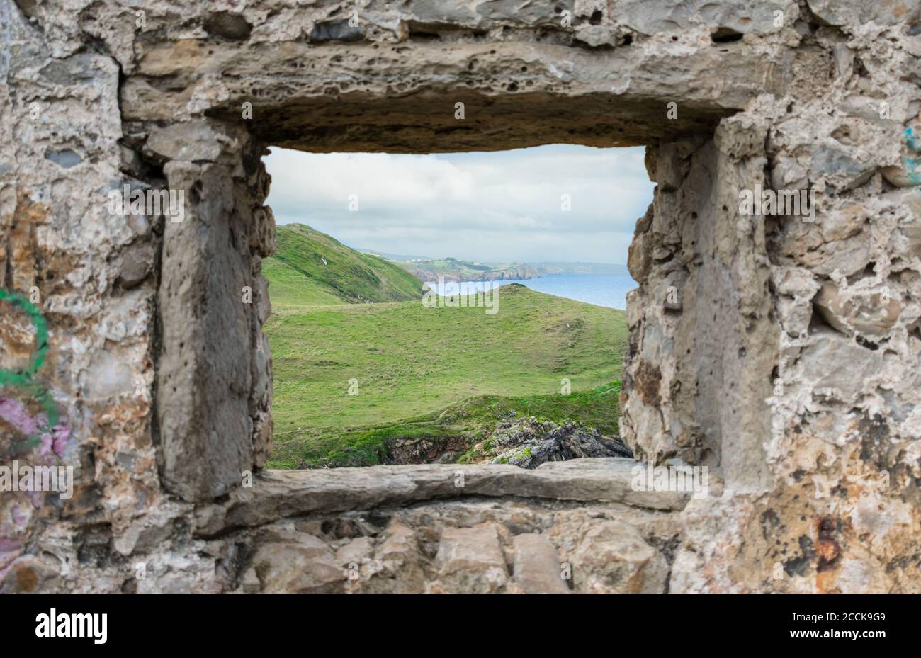view of cantabria coast through the ruins window Stock Photo - Alamy