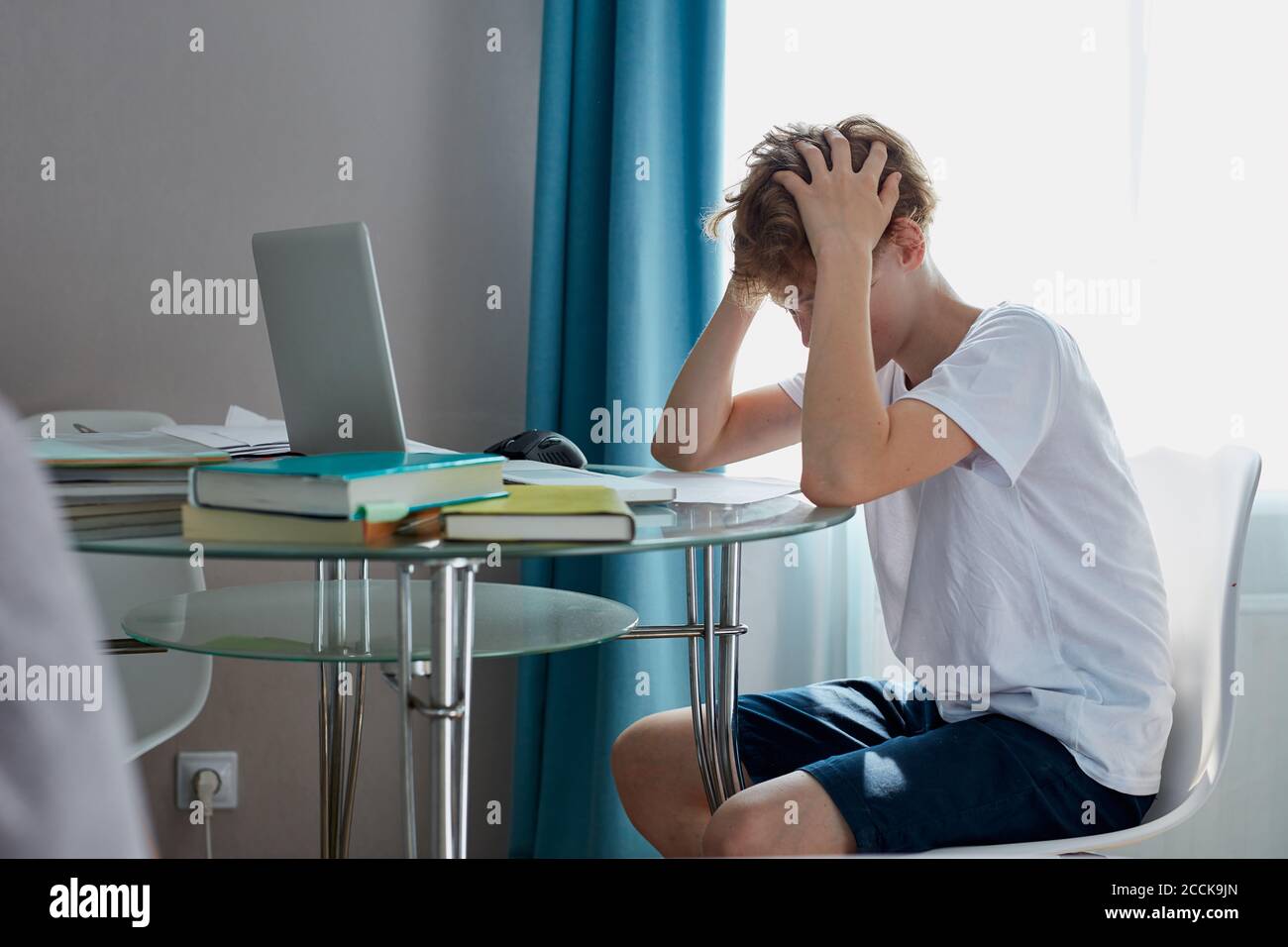 depressed school boy doesn't want to study, has bad grades in school ...