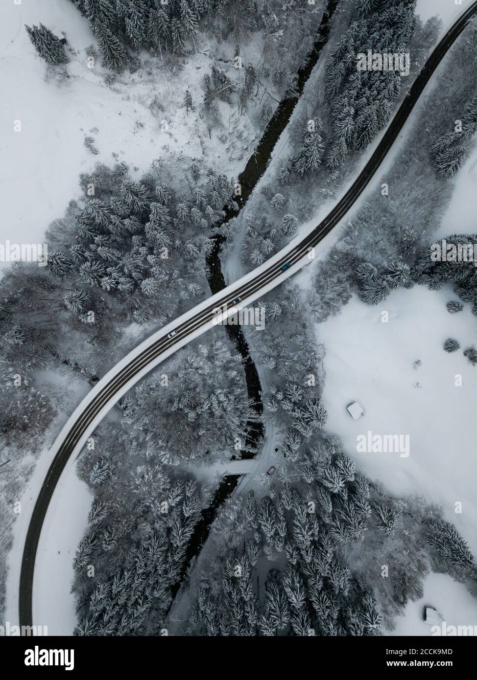 Aerial view of asphalt road stretching over river Ach flowing through ...