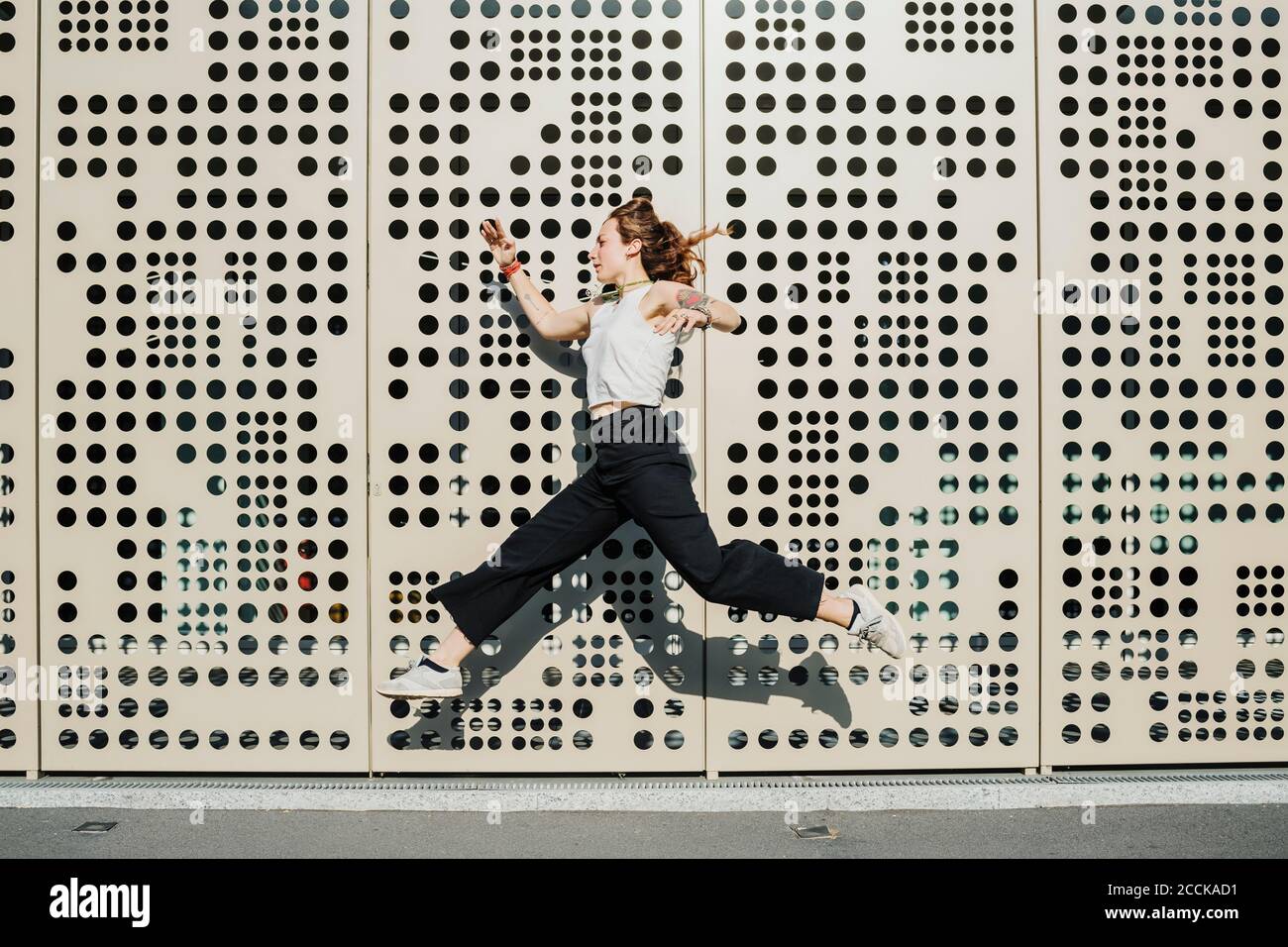 Woman hole wall hi-res stock photography and images - Alamy