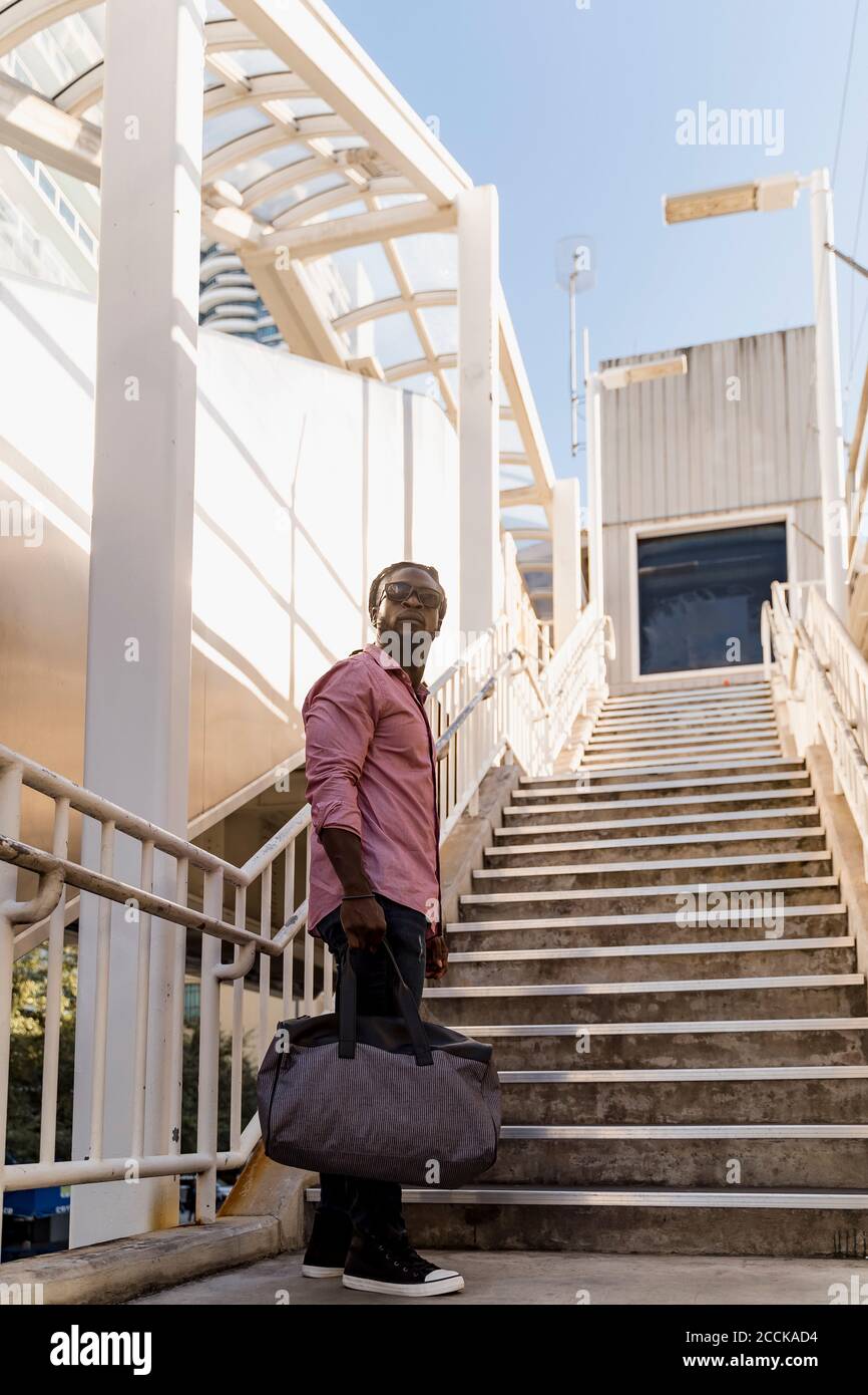 Young person standing on steps hi-res stock photography and images - Alamy