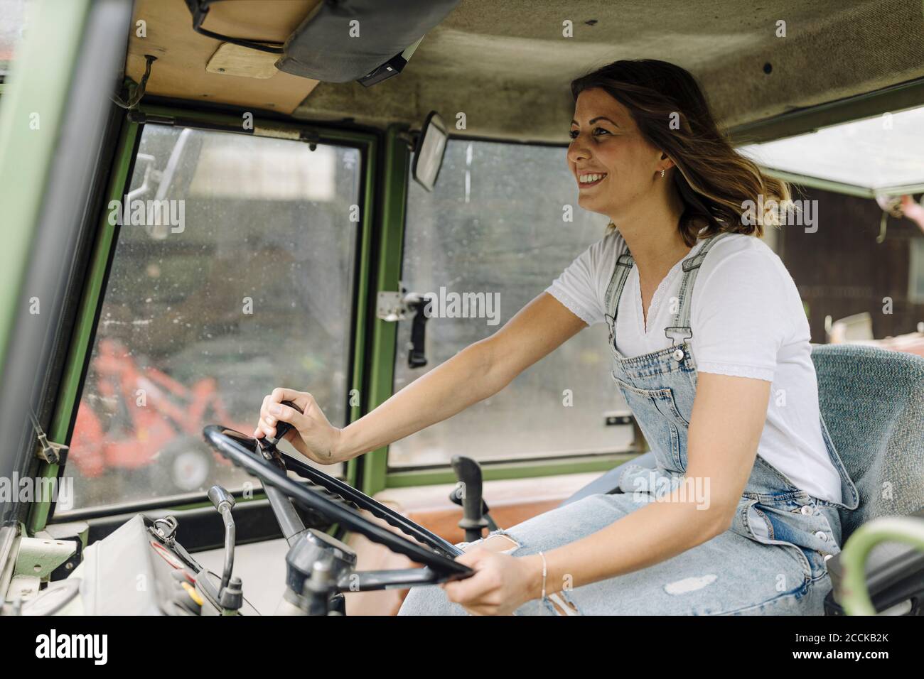 Woman driving tractor hi-res stock photography and images - Alamy