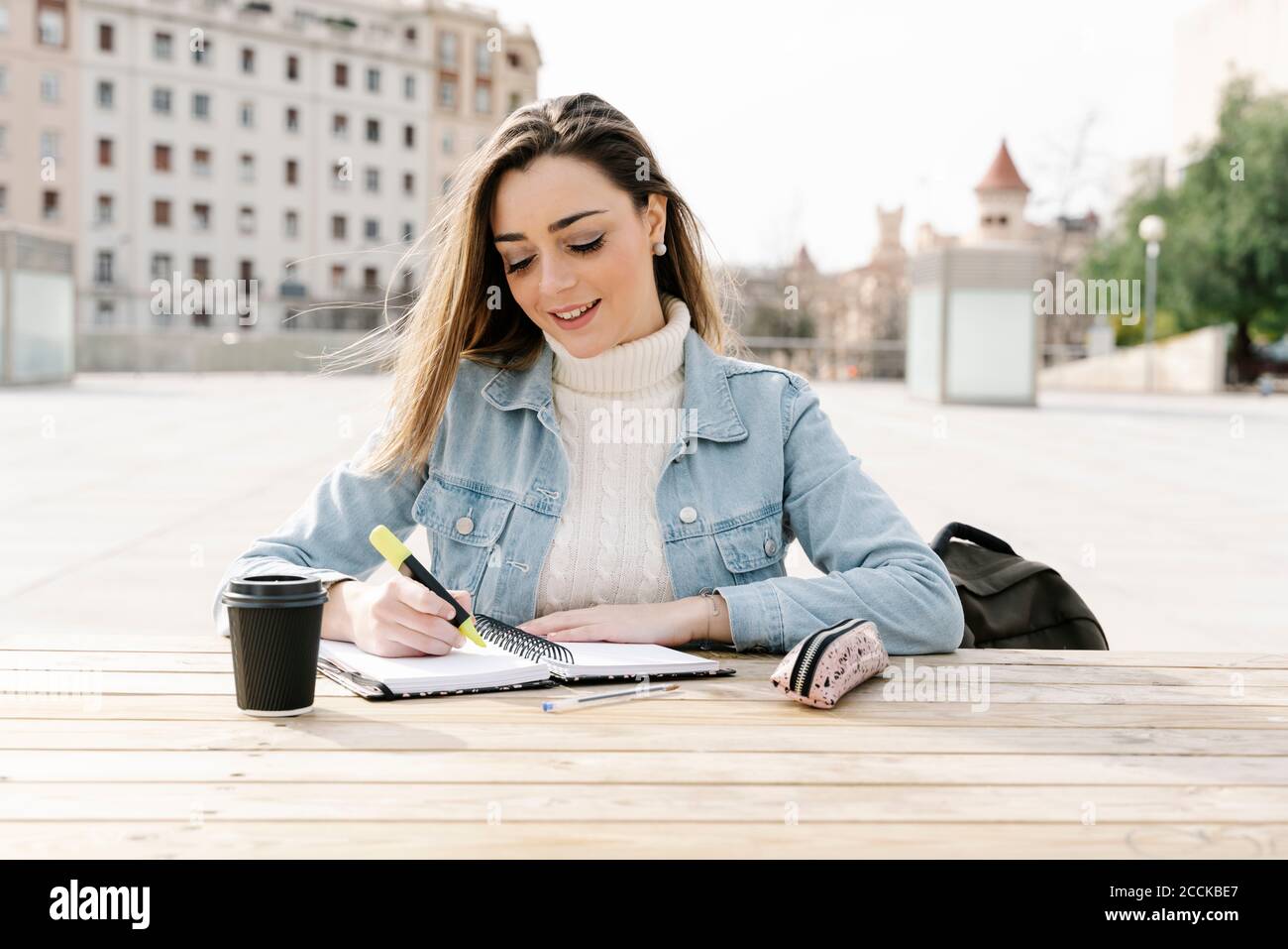 Female student studying at table in university campus Stock Photo - Alamy