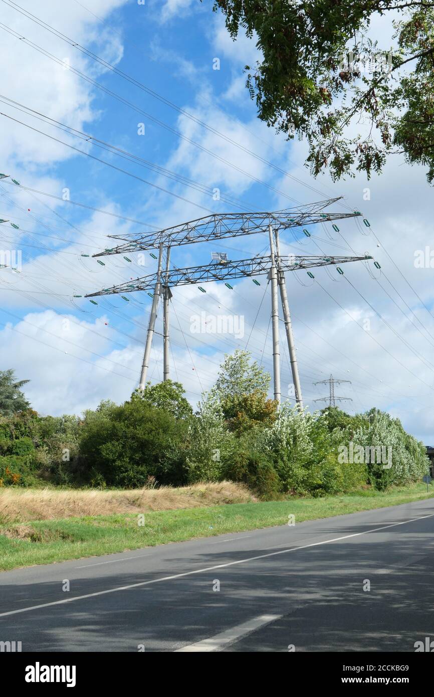 Group of electric pylons, high voltage lines. Overhead cables carrying ...