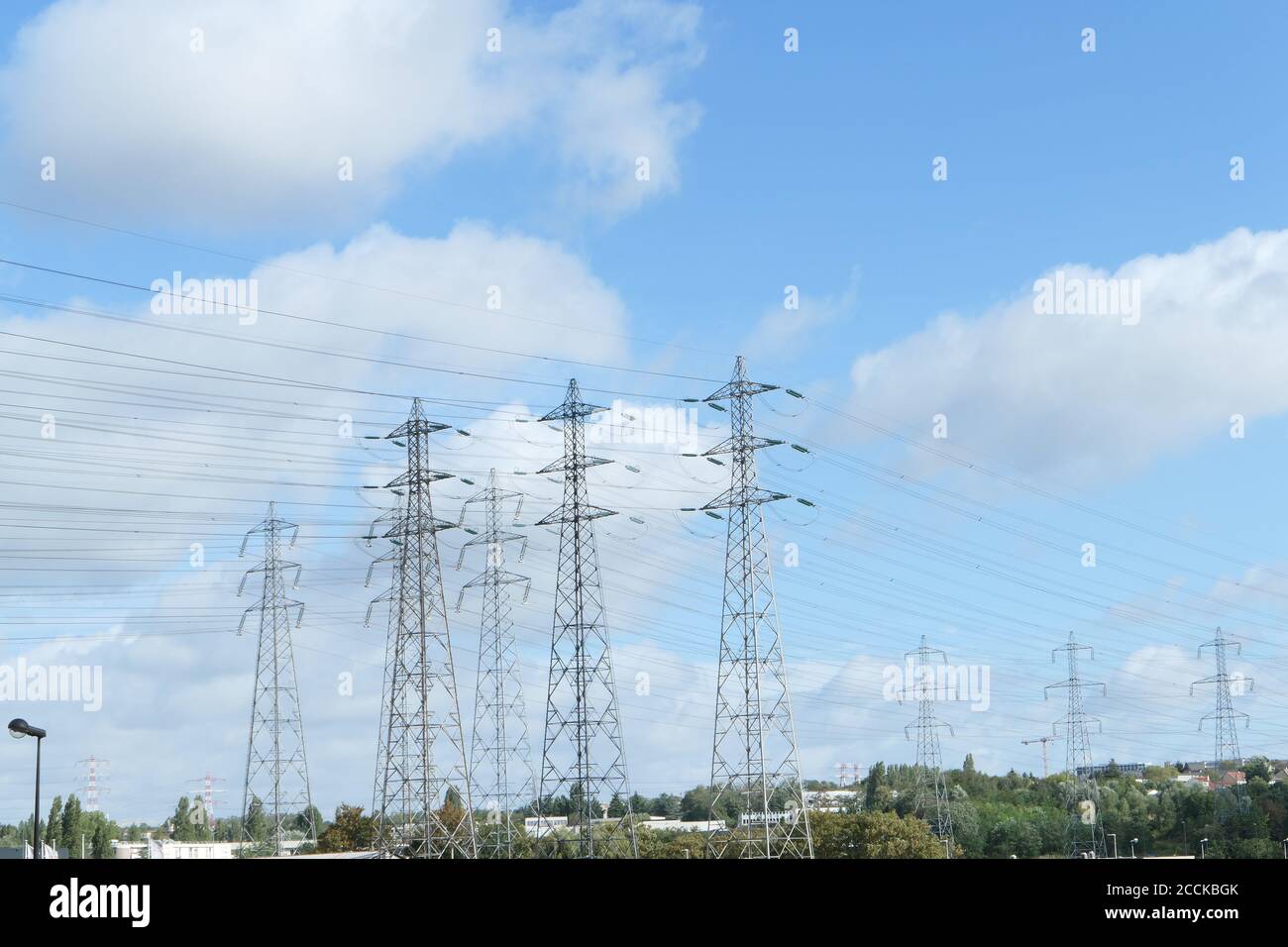 Group of electric pylons, high voltage lines. Overhead cables carrying ...