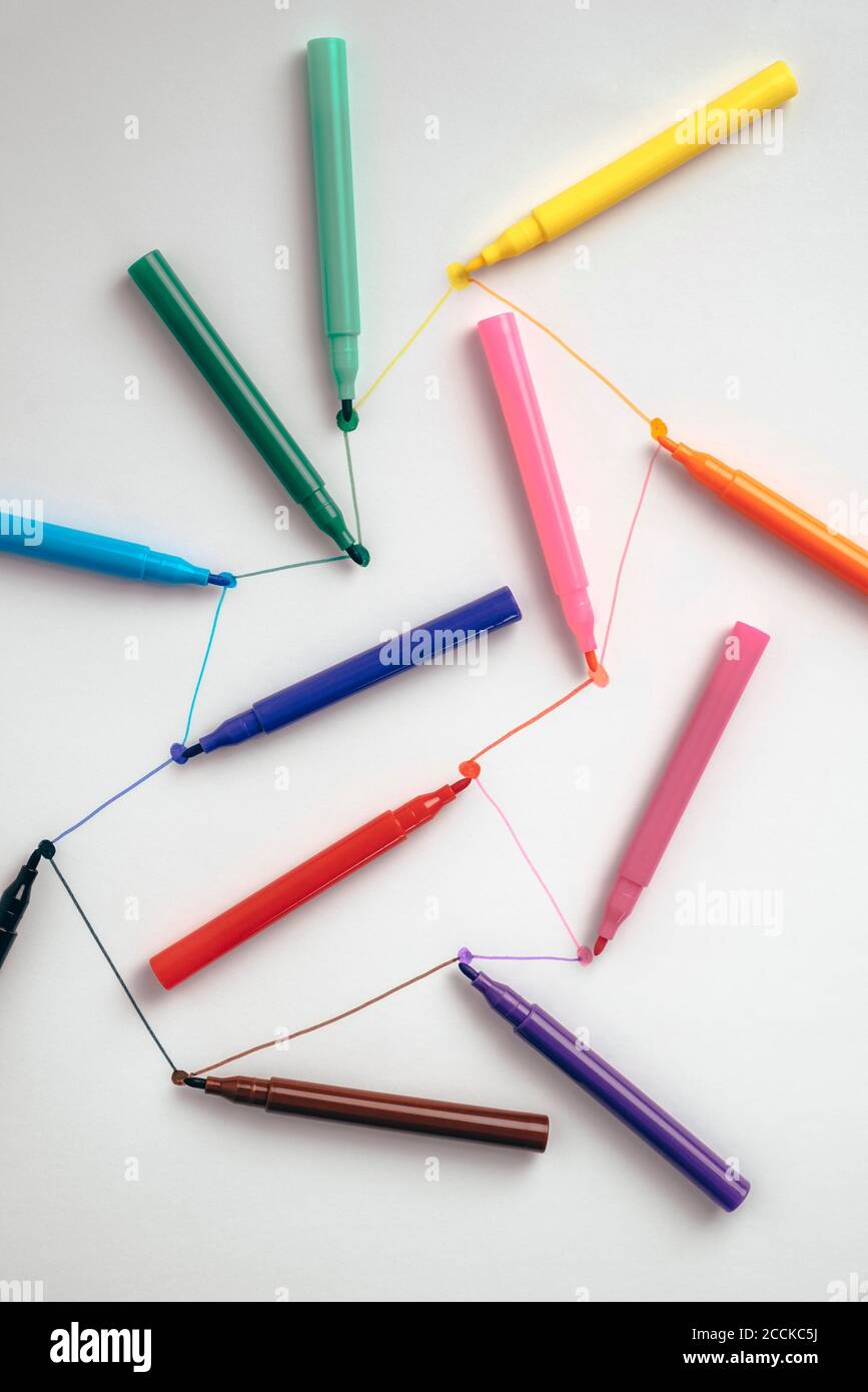 Colorful felt tip pens connected with lines Stock Photo - Alamy