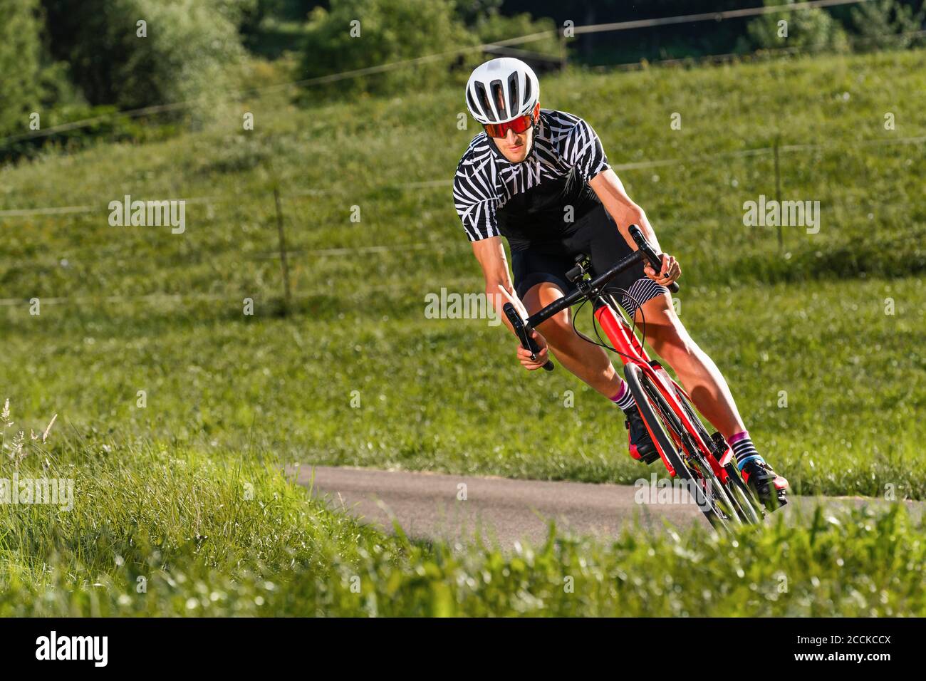 Cyclist riding racing bike hi-res stock photography and images - Alamy