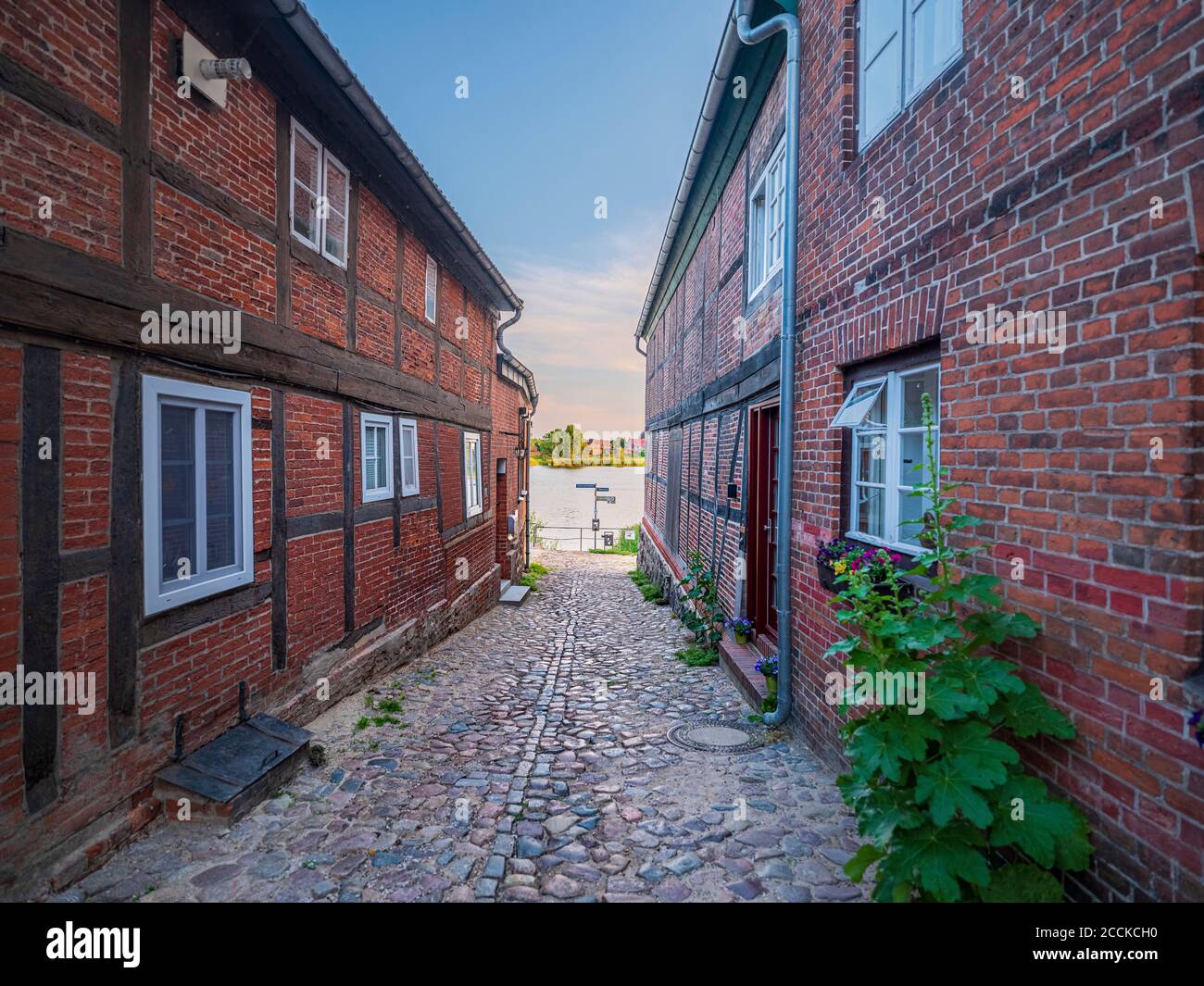 Cobblestone alley between houses historical town hi-res stock ...
