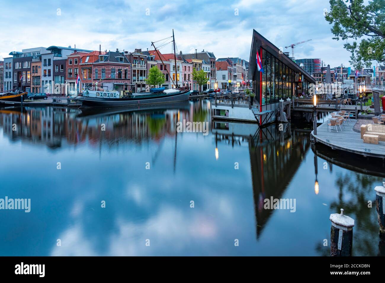 Netherlands, South Holland, Leiden, Buildings reflecting in Oude Rijn ...