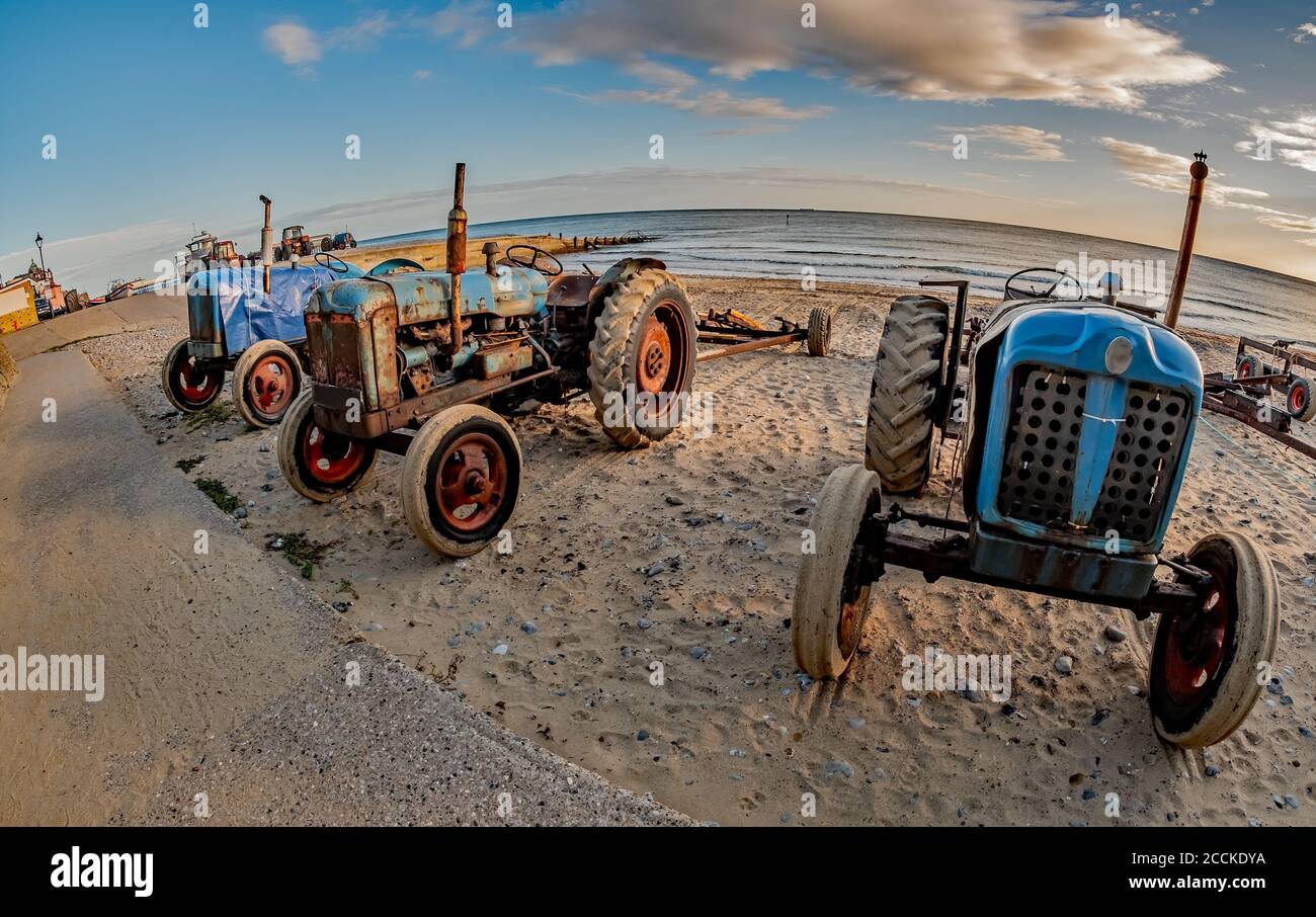 Fisheye view of agircultural tractors on Cromer beach. Crab fishermen ...