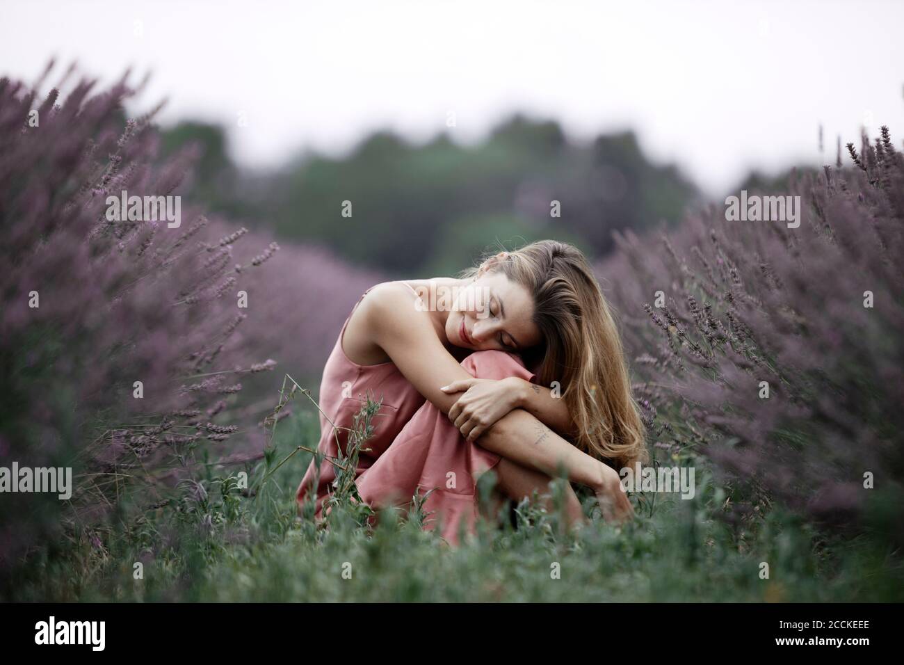 Women sitting in flower field hi-res stock photography and images - Alamy