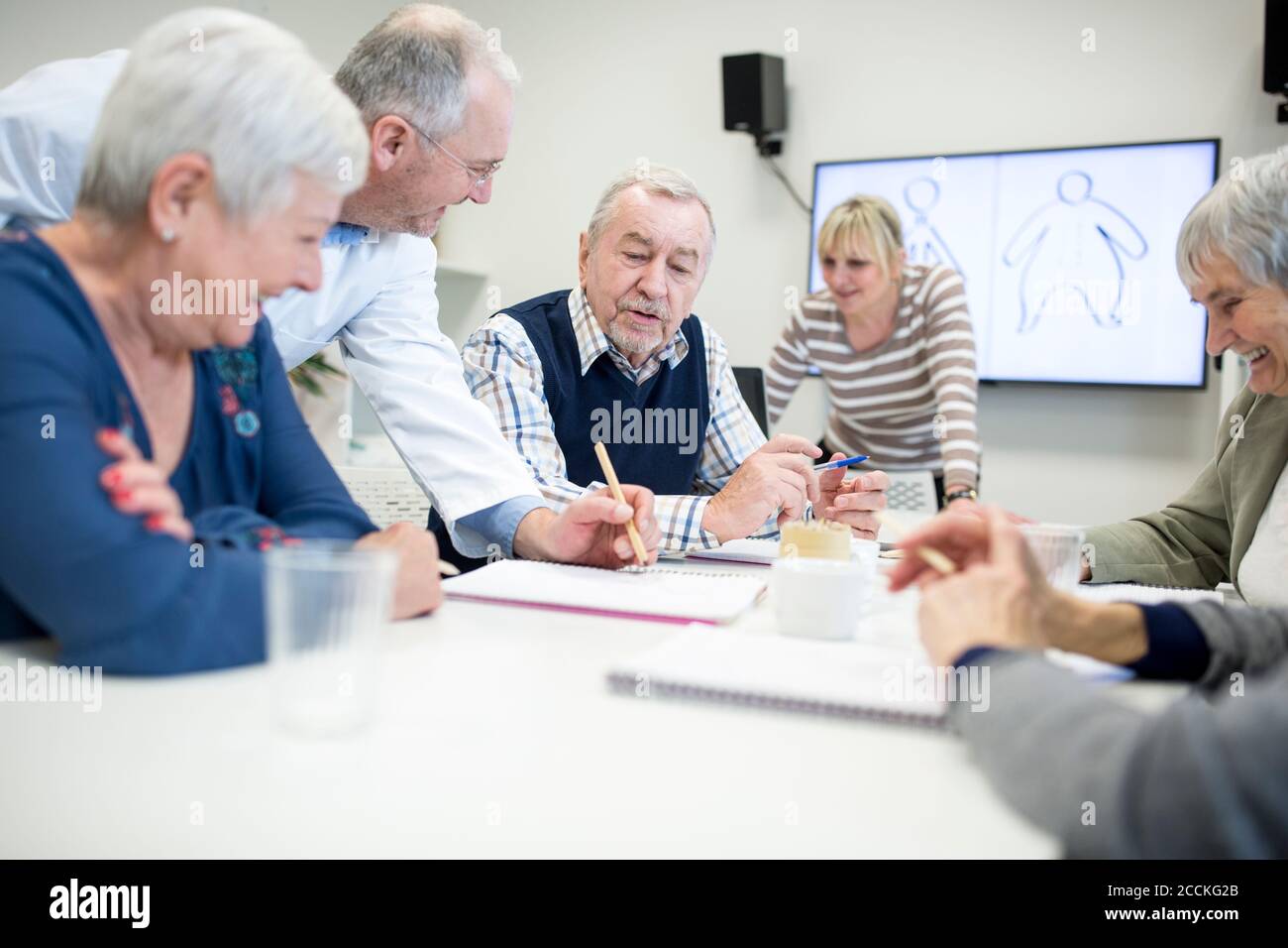 Senior citizens attending public health course Stock Photo - Alamy