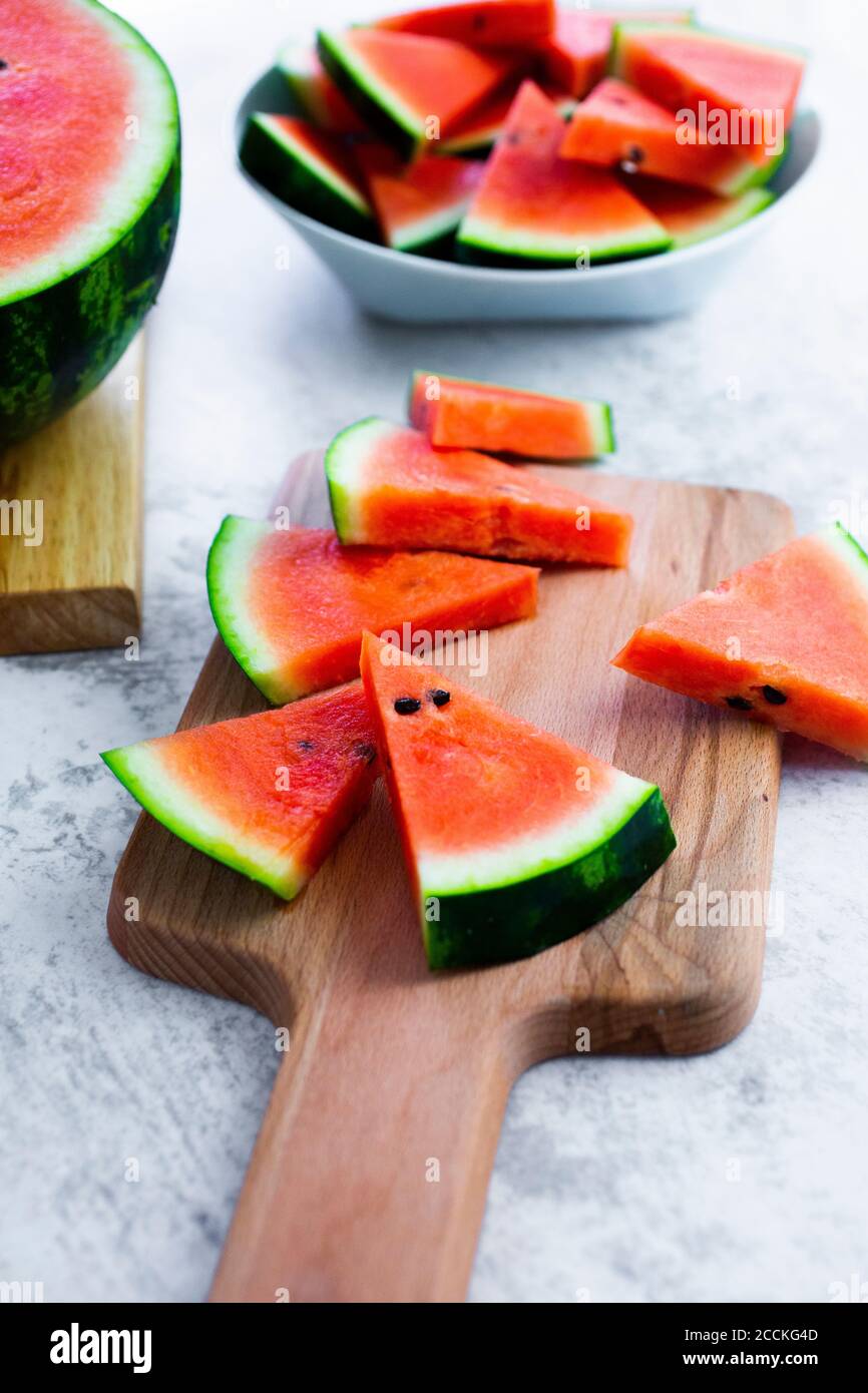 Chopped watermelon on chopping board Stock Photo - Alamy