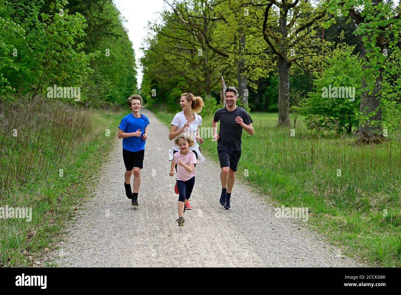 Boy jogging on road hi-res stock photography and images - Alamy