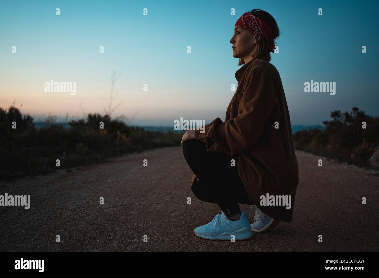 Side view woman crouching on hi-res stock photography and images - Alamy