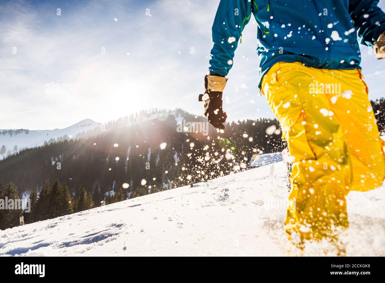 Man running through the snow, Achenkirch, Austria Stock Photo - Alamy