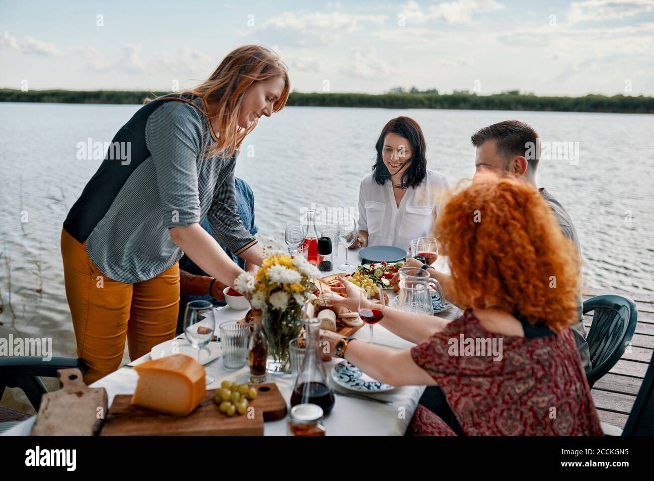 Group having dinner hi-res stock photography and images - Alamy