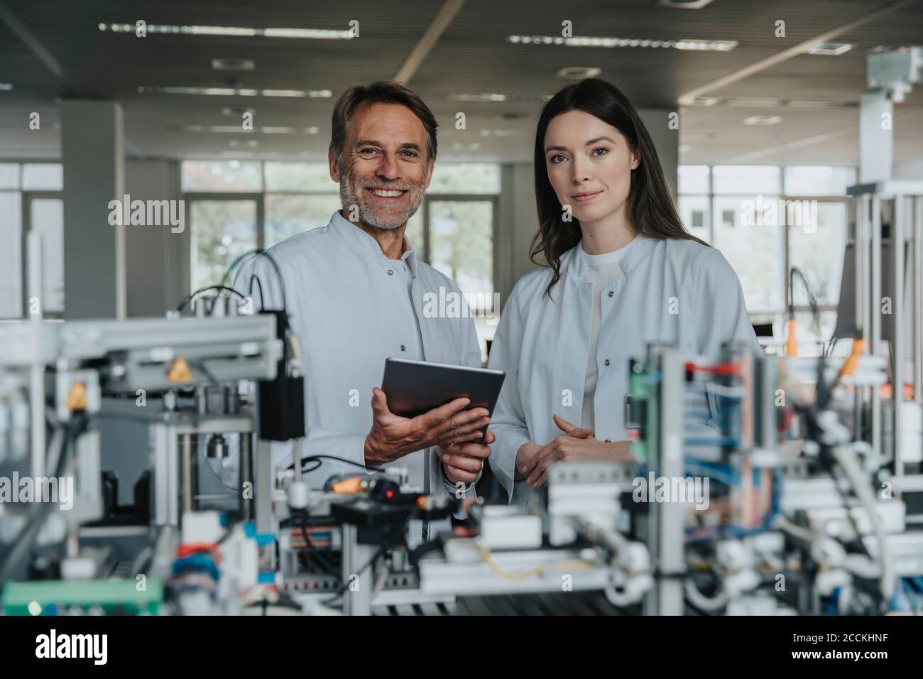Two engineers looking at computer hi-res stock photography and images ...