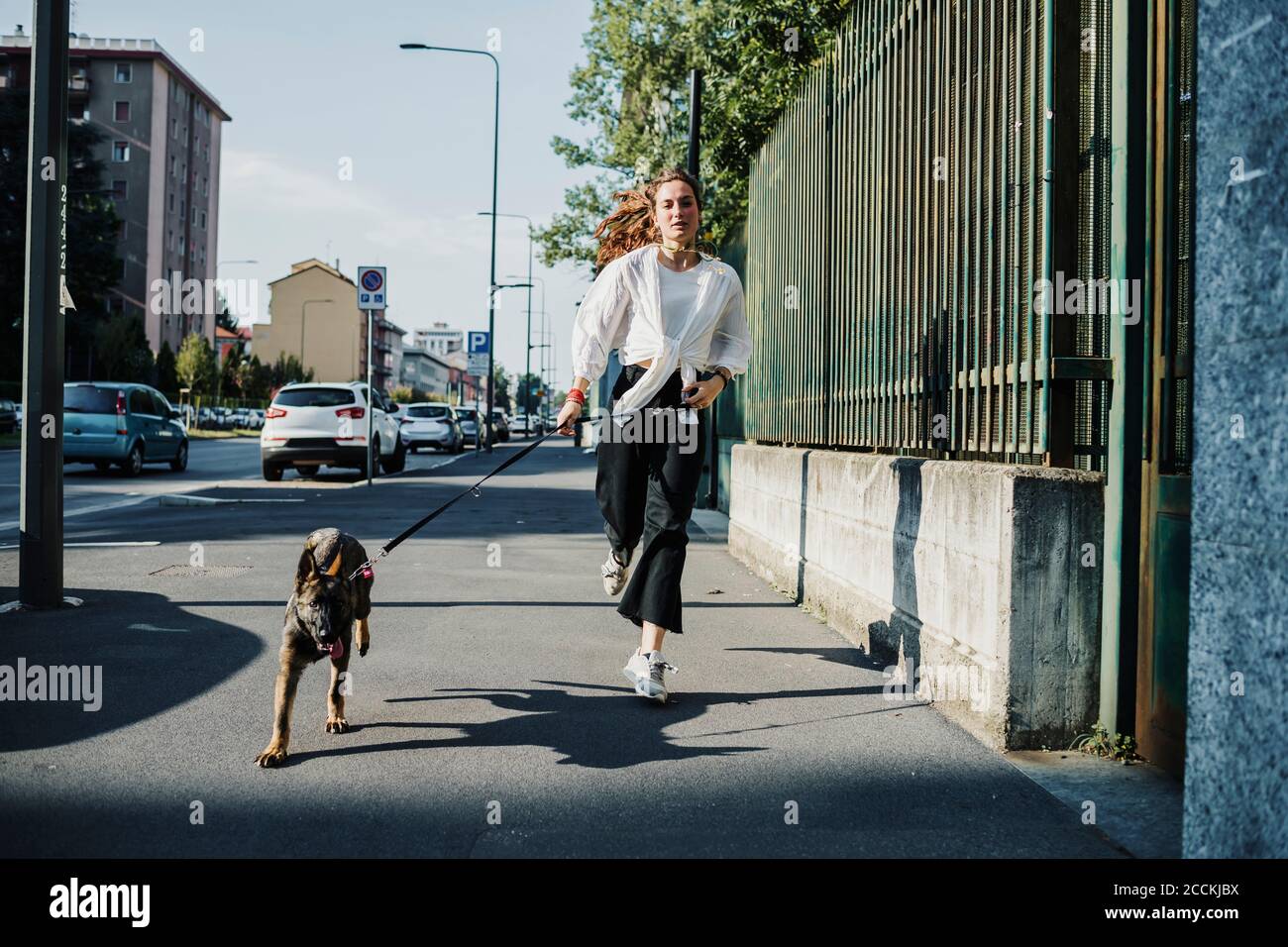 Woman running with dog hi-res stock photography and images - Alamy