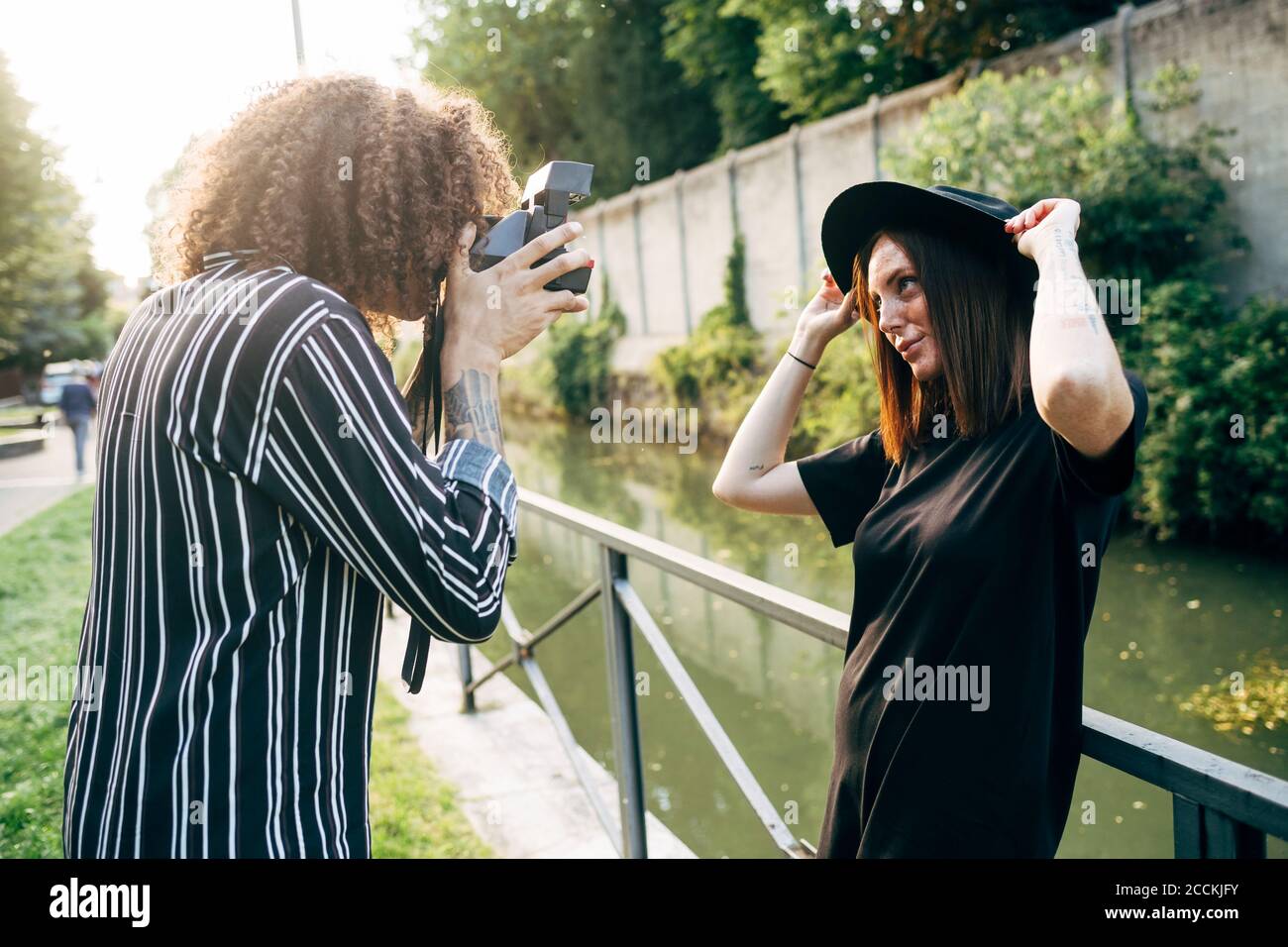 Man photographing his girlfriend hi-res stock photography and images ...