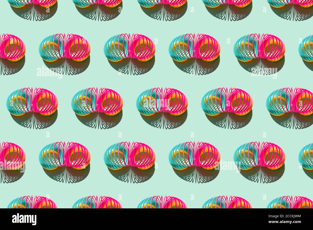 Pattern of rows of plastic Slinky springs Stock Photo - Alamy
