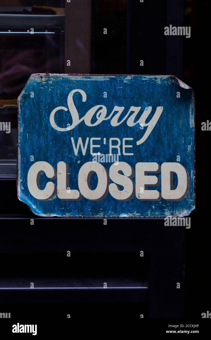 Blue weathered closed sign Stock Photo - Alamy