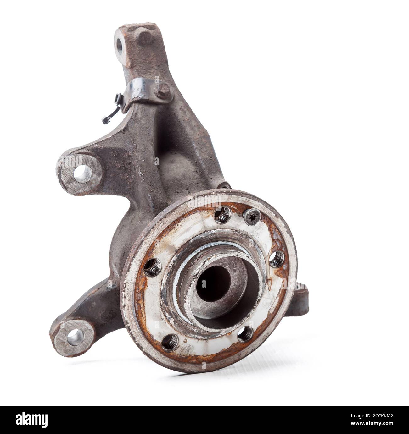 A close-up of a worn metal wheel hub with oil and rust elements on a ...