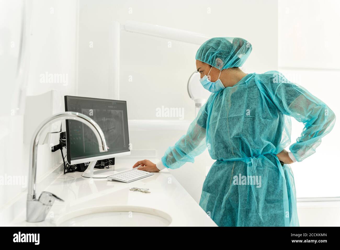 Female nurse working on computer at dentist clinic Stock Photo - Alamy