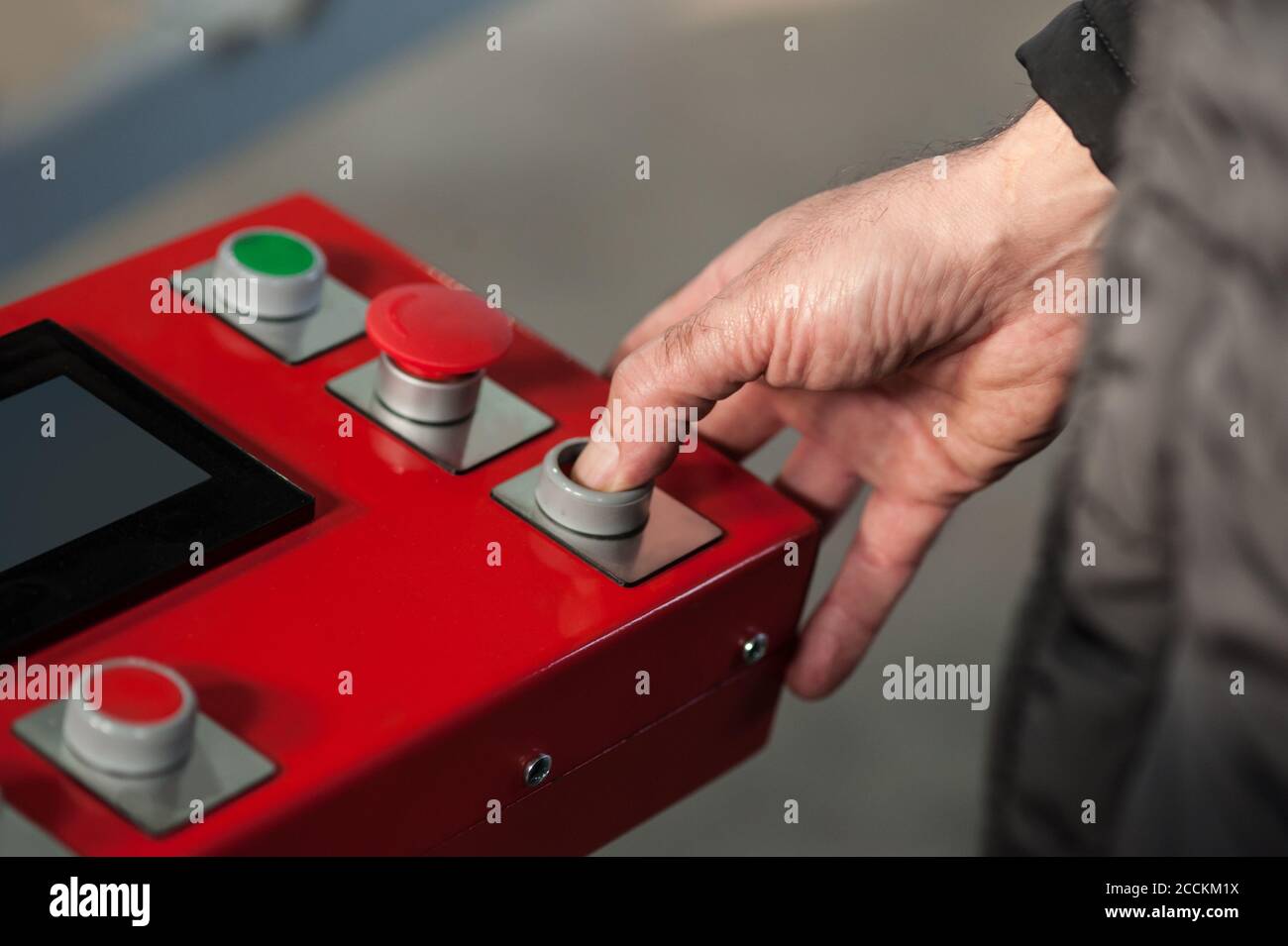 Industrial machinery mechanics and factory worker adjusts industry ...
